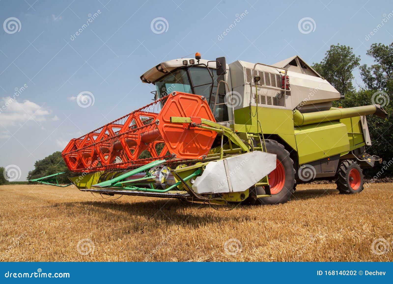 Combine Working on a Wheat Field Stock Photo - Image of farmer, grow ...