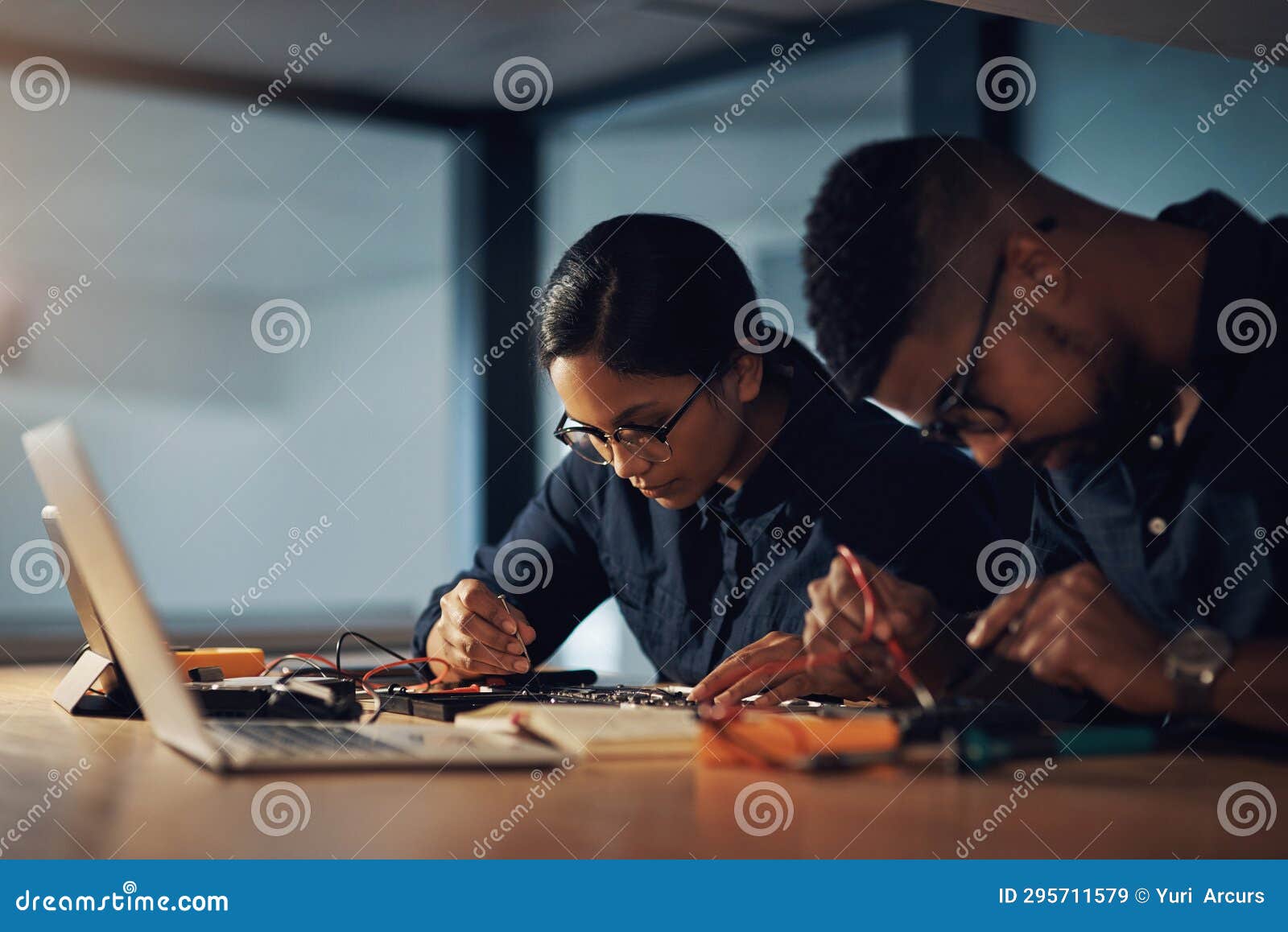 Combined Expertise Gets the Computer Repaired Quicker. Two Young ...