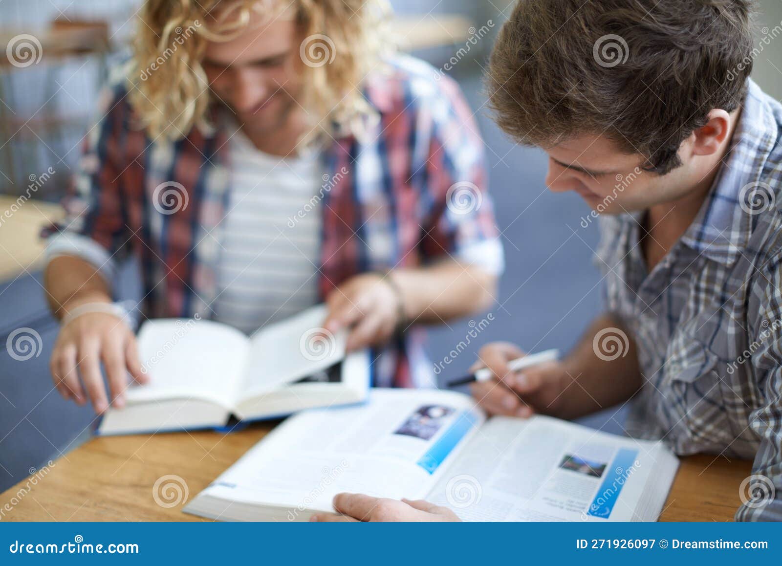 Combining Their Assignment Research. Two Male Students Studying ...
