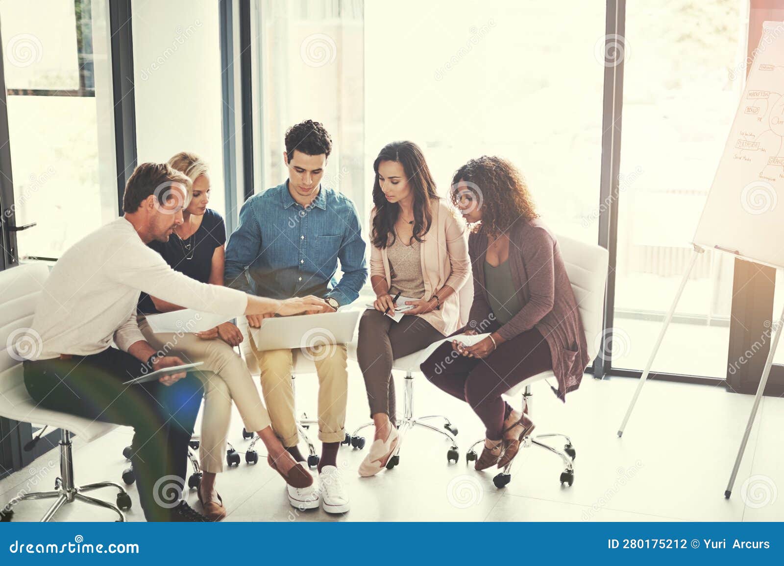 Combining Their Creative Know-how. a Team of Designers Brainstorming ...