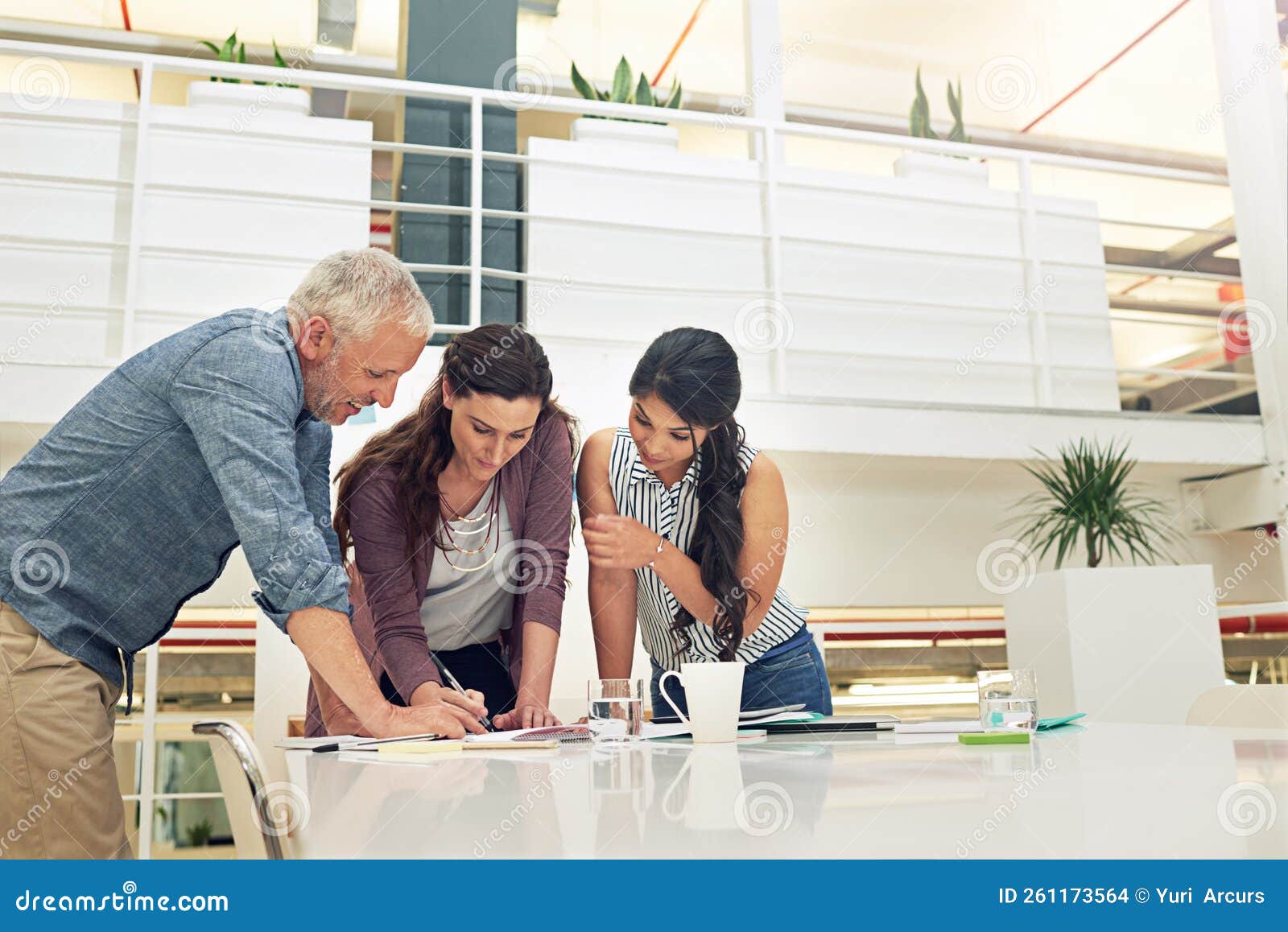 Combining Their Knowledge, Skills and Experience. a Team of Colleagues ...