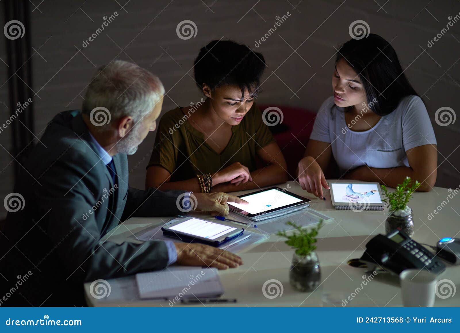 Combining Their Technical Knowhow. Shot of a Group Colleagues Using ...