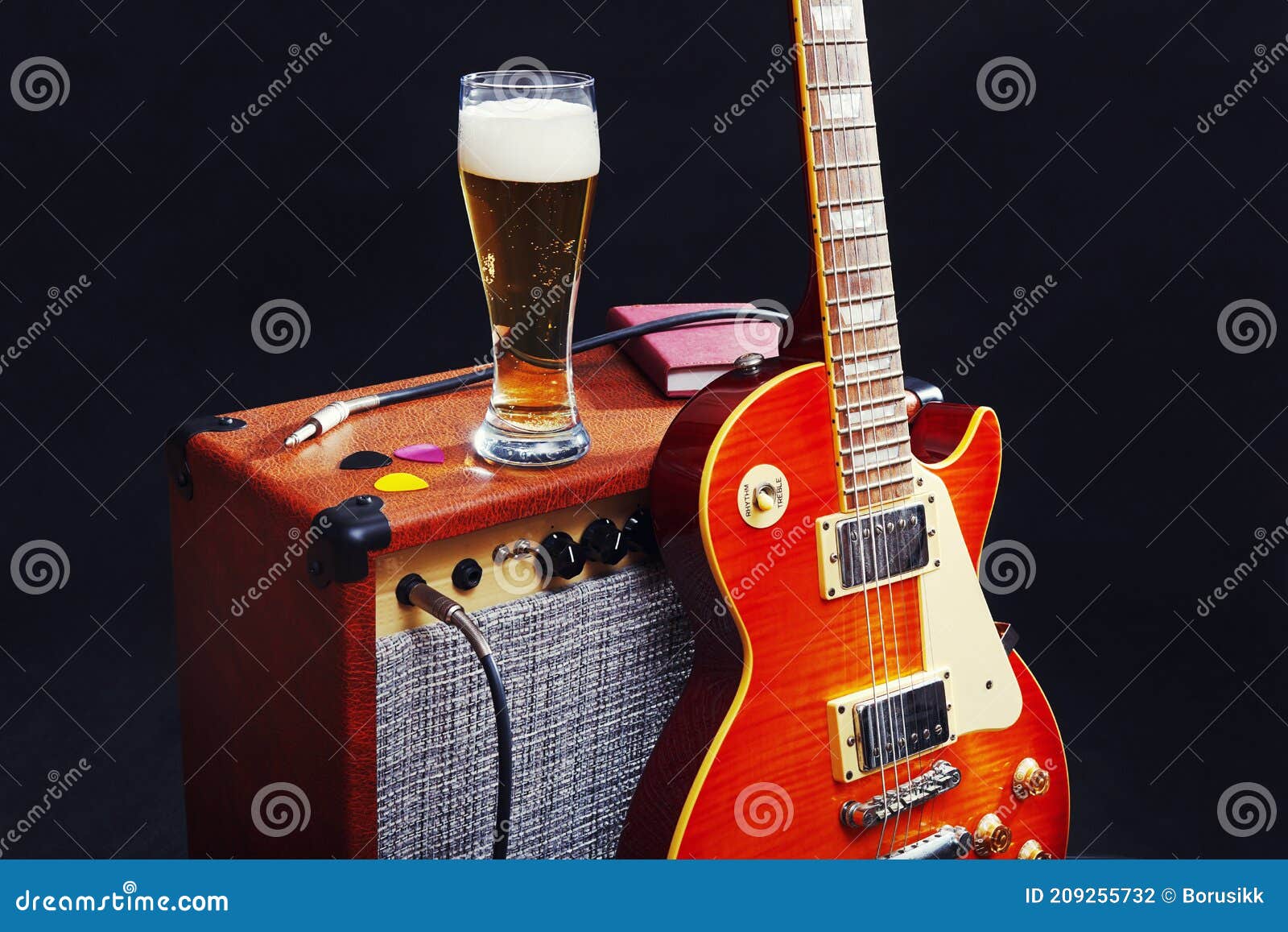 Combo for Guitar with Guitar, Glass of Beer and Notepad on Black ...