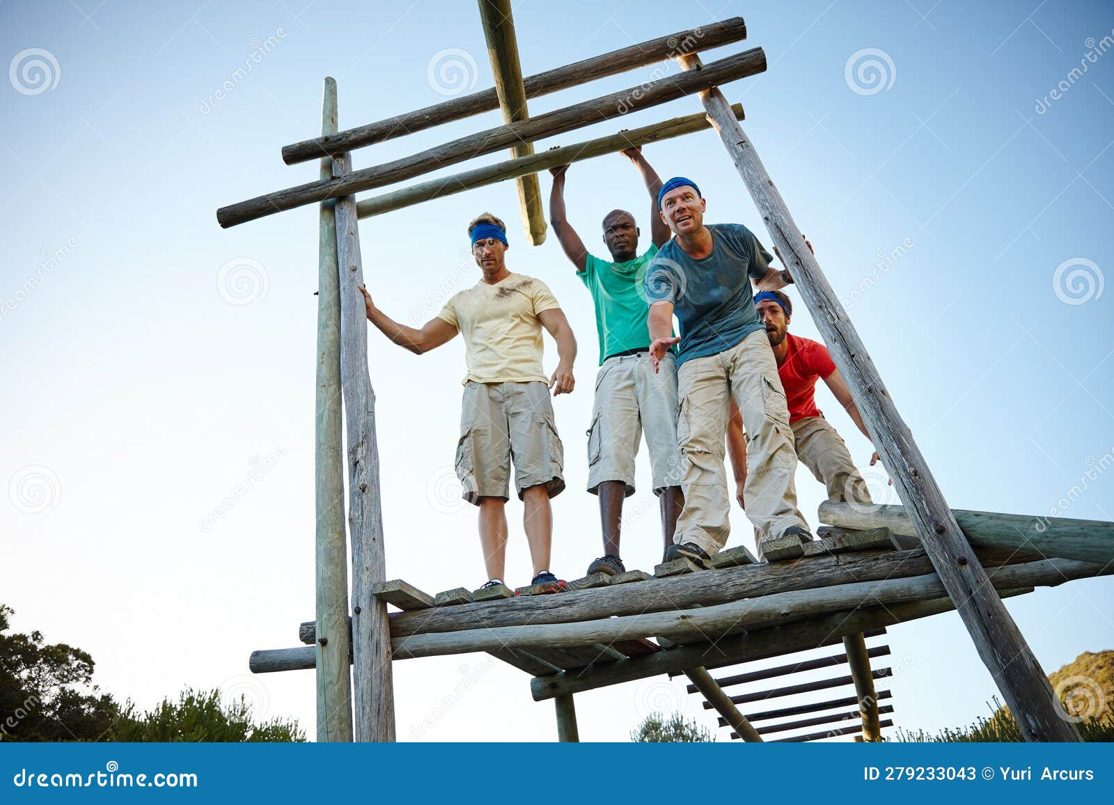 Come on, You Can Do it. a Group of Men Going through an Obstacle Course ...