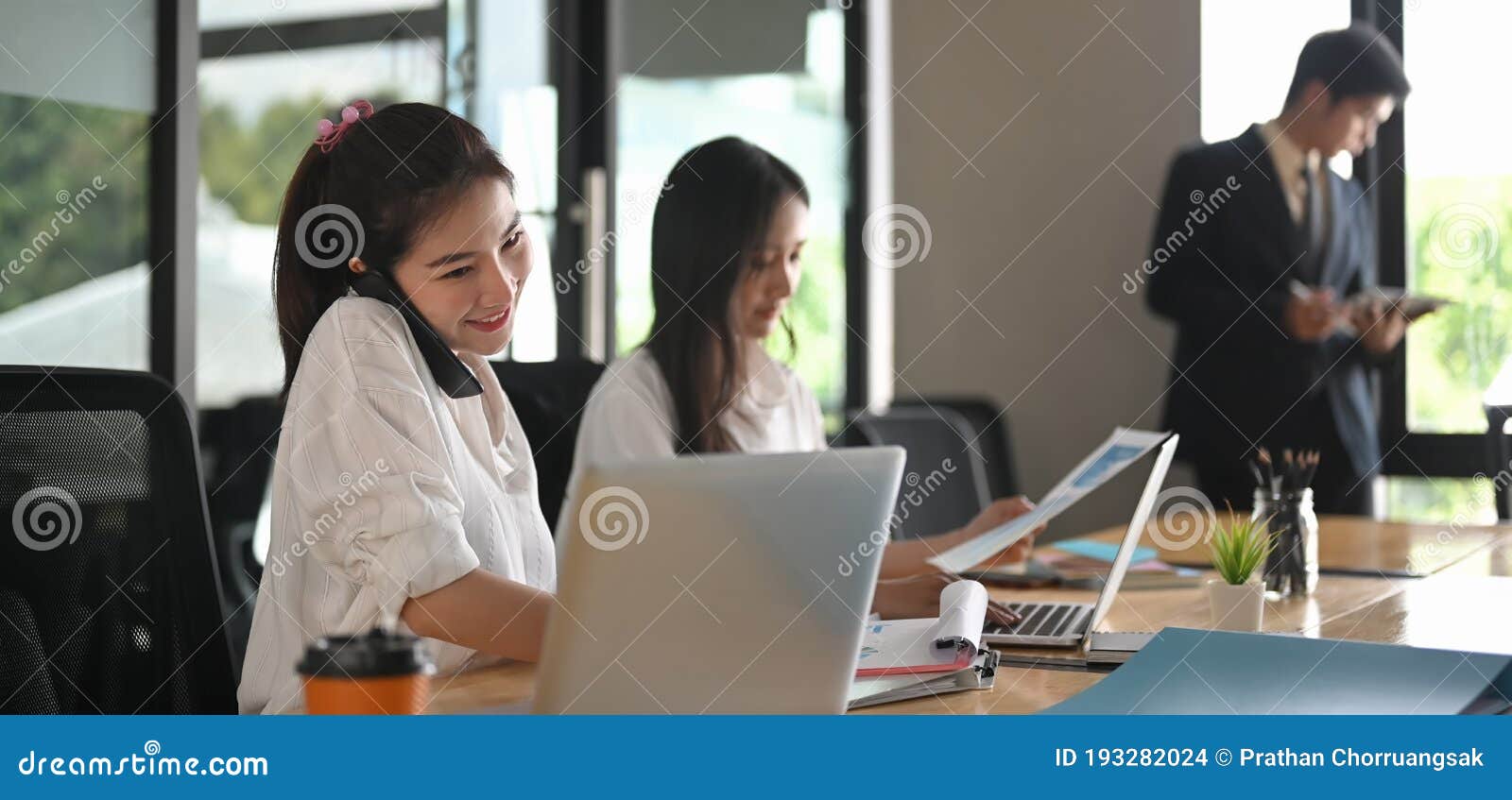 A Comfortable Business Workspace is Surrounding by a Happy Employee and ...