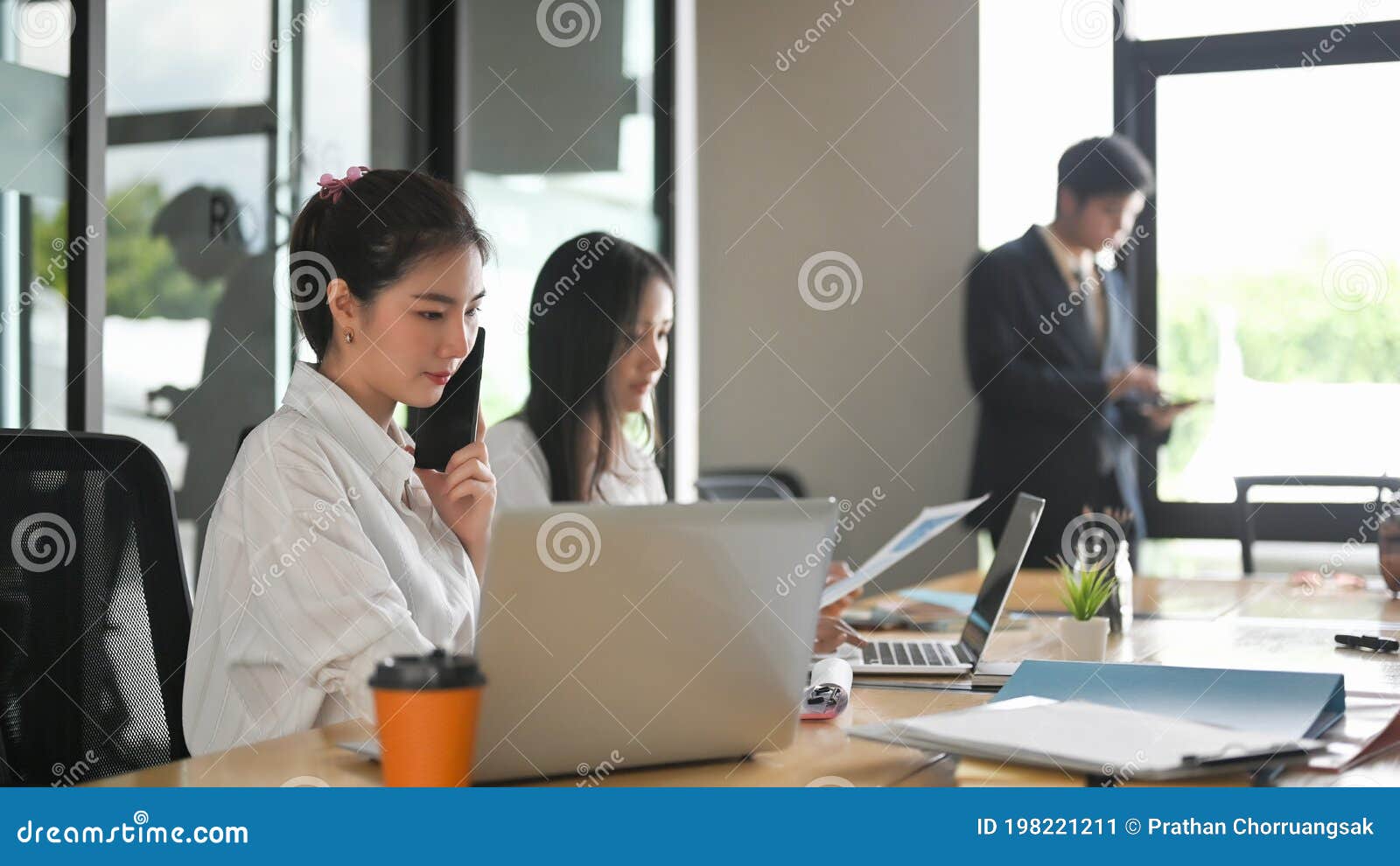 A Comfortable Business Workspace is Surrounding by a Happy Employee ...