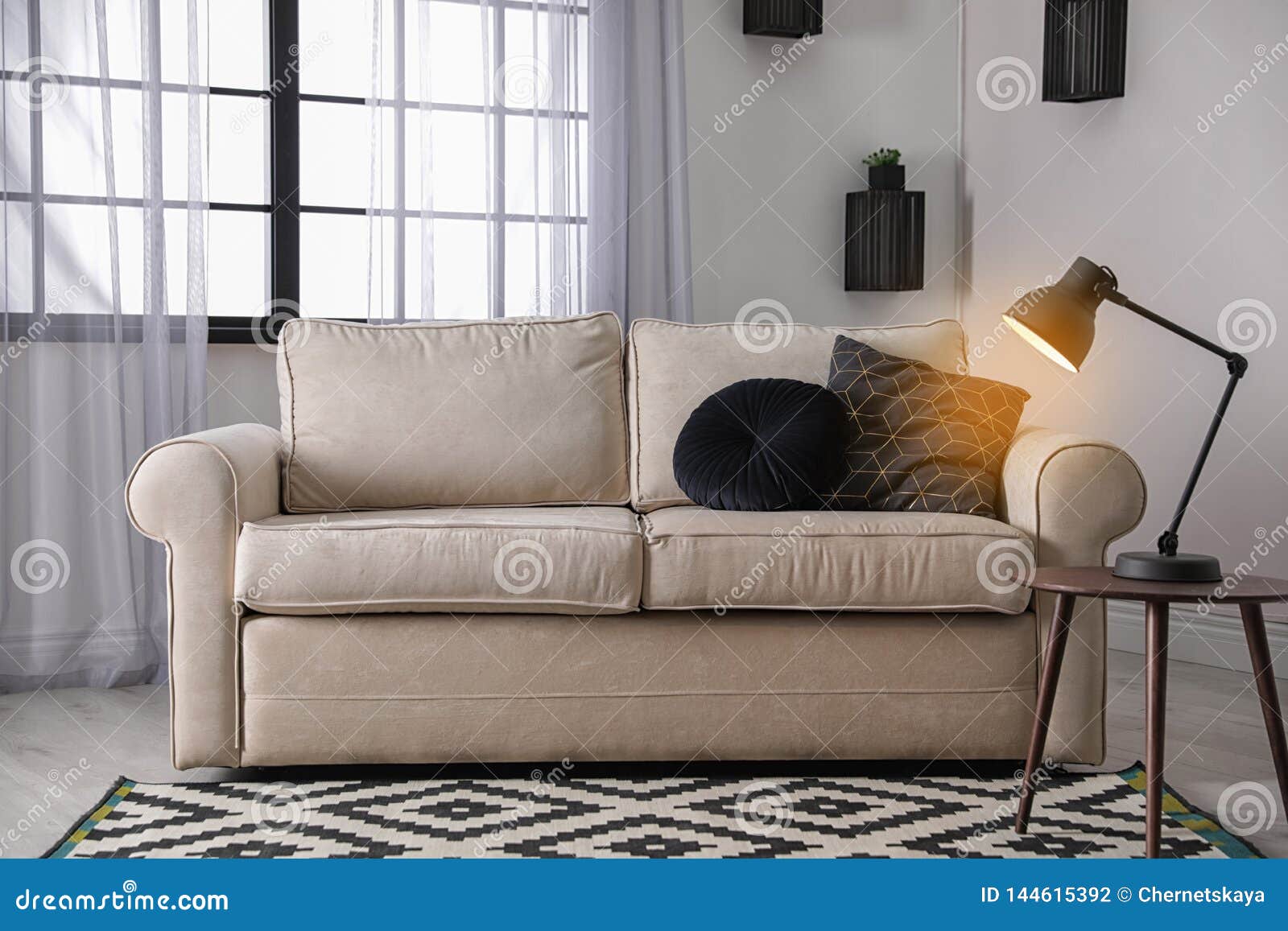 Comfortable Couch Near Window in Modern Living Room Stock Photo - Image ...