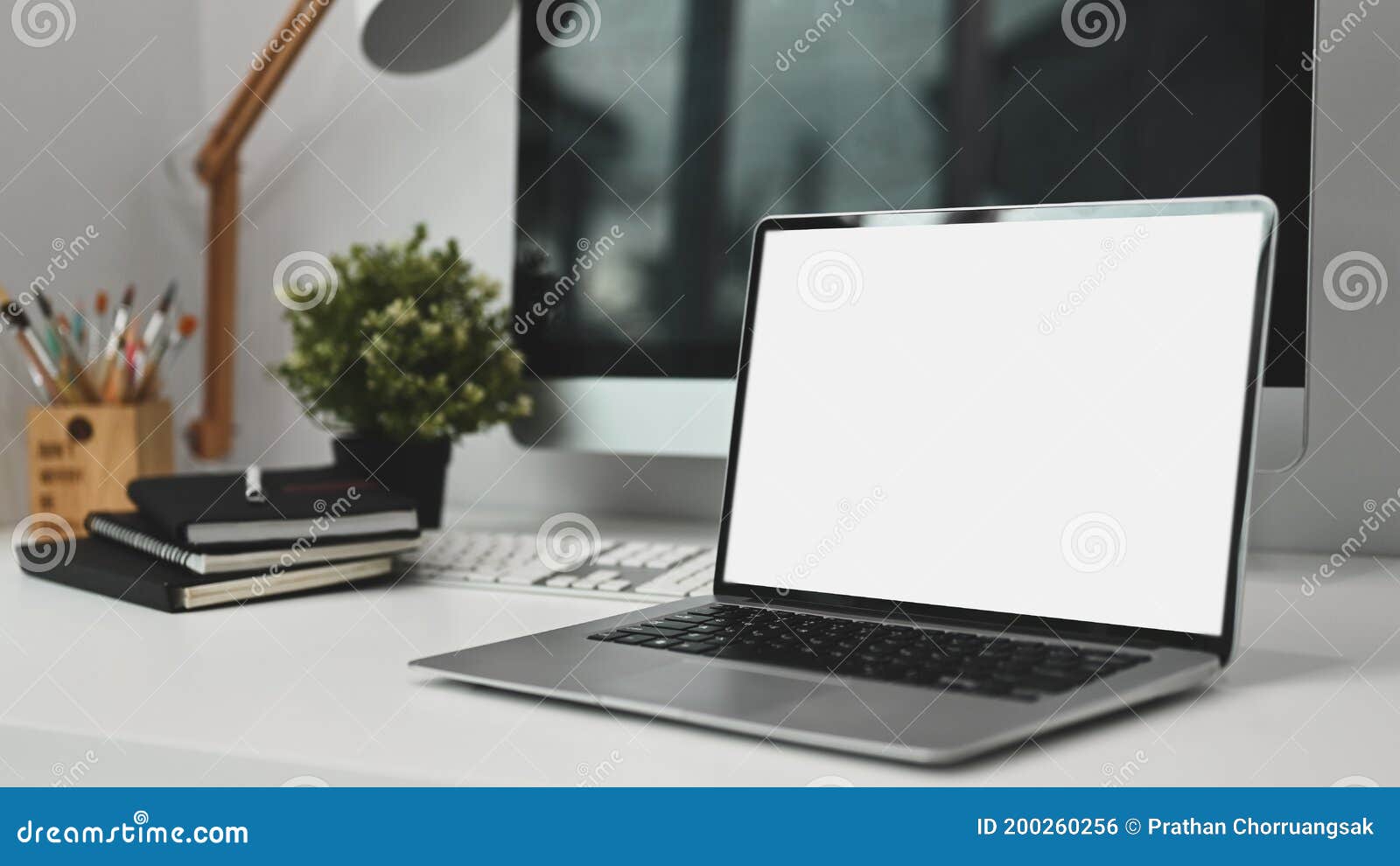 Comfortable Workplace. a Computer Laptop with White Blank Screen ...