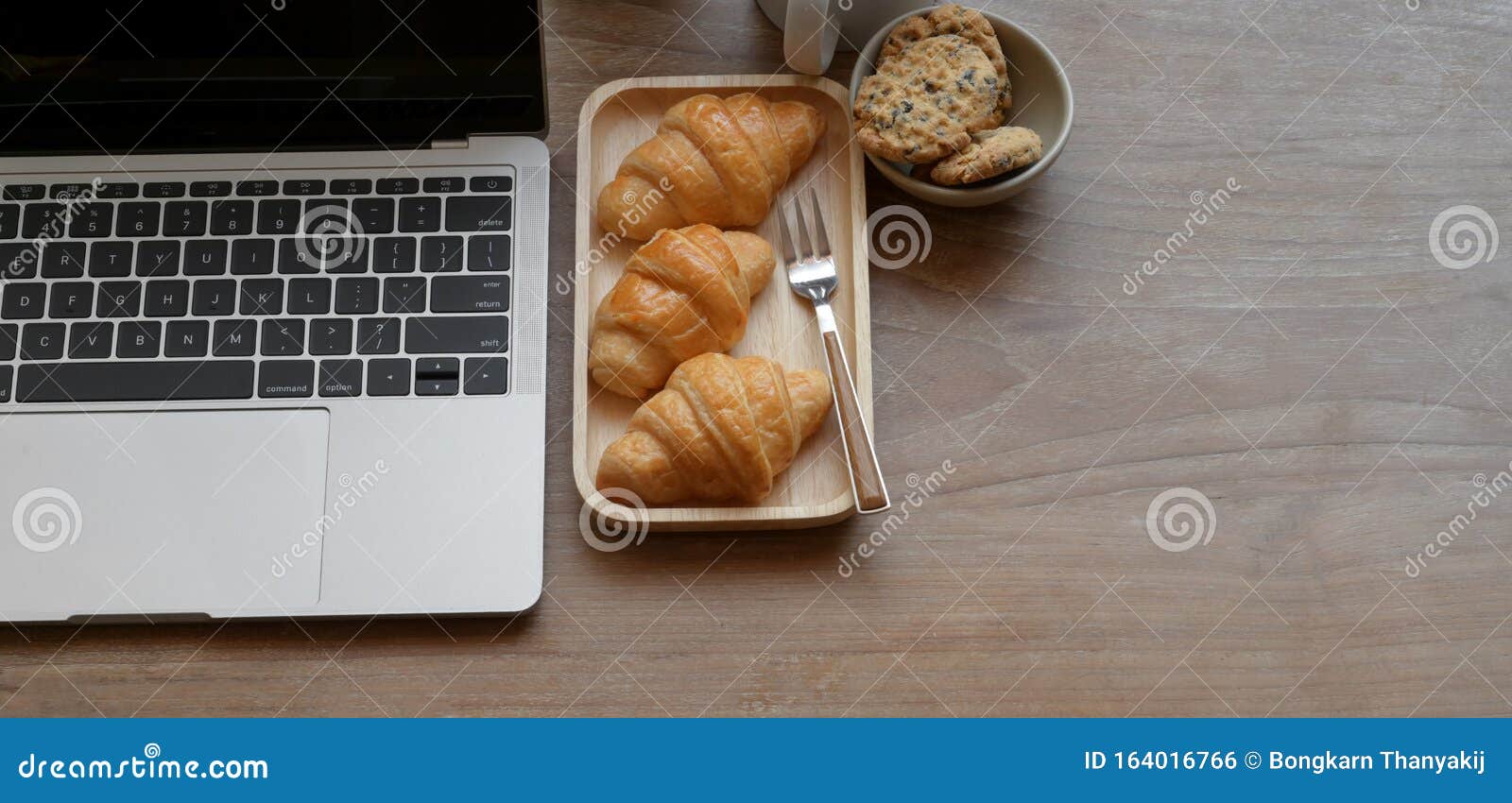 Comfortable Workplace with Laptop Computer and Breakfast on Wooden ...