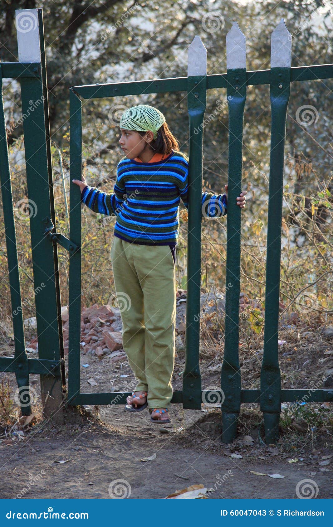 Coming through the gate editorial stock photo. Image of girl - 60047043