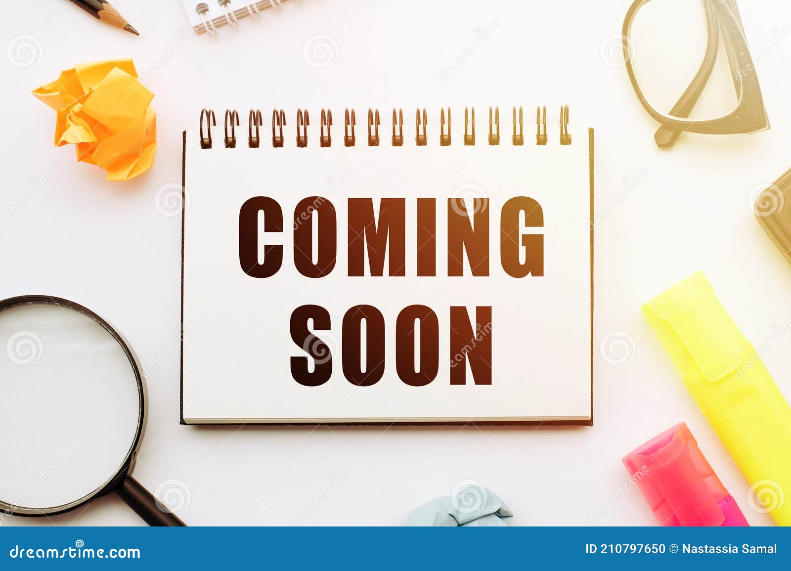 COMING SOON. Text in Notebook on White Table with Office Tools Stock ...