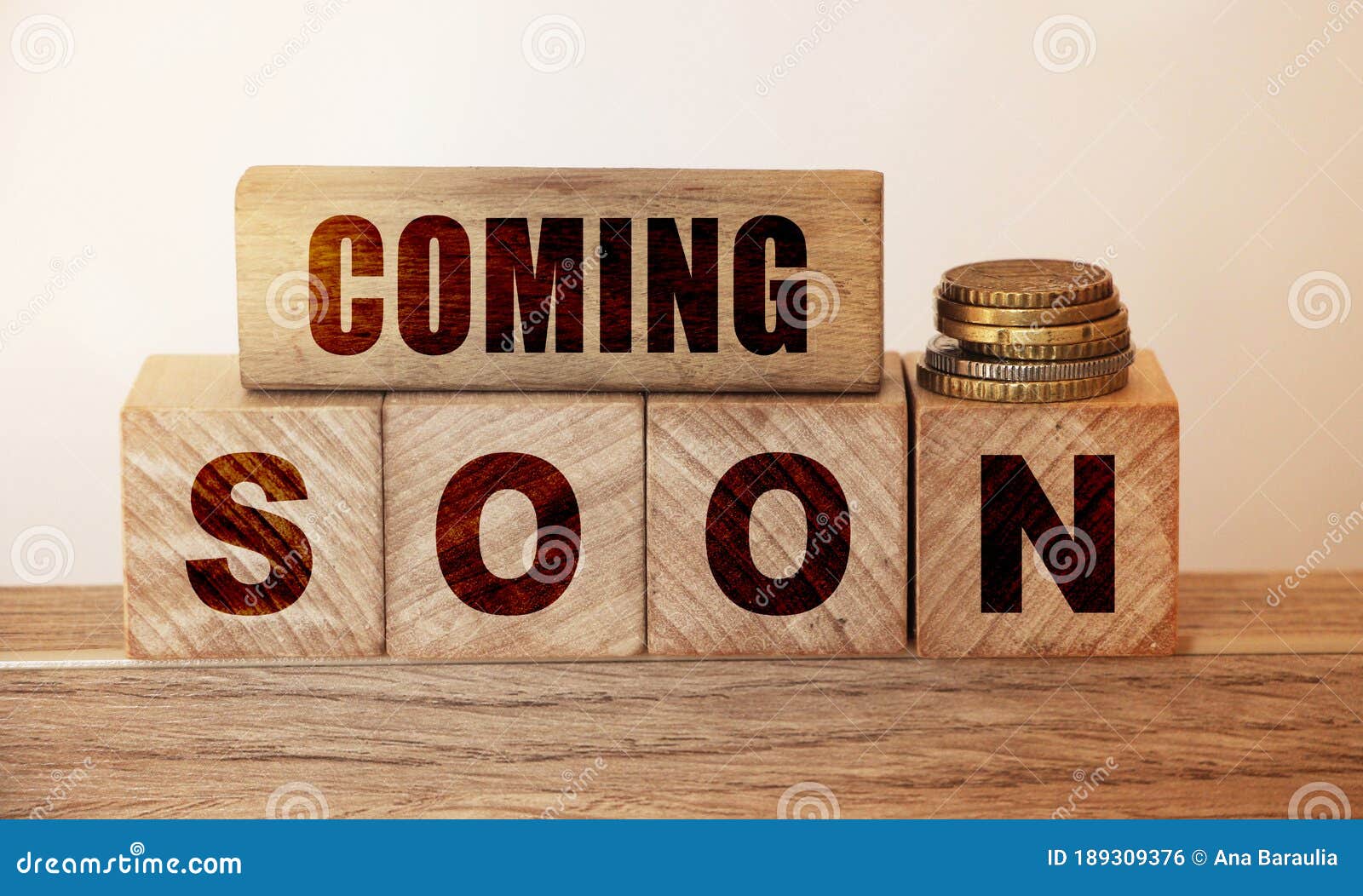 Coming Soon Text on a Wooden Background and Stack of Coins Stock Photo ...