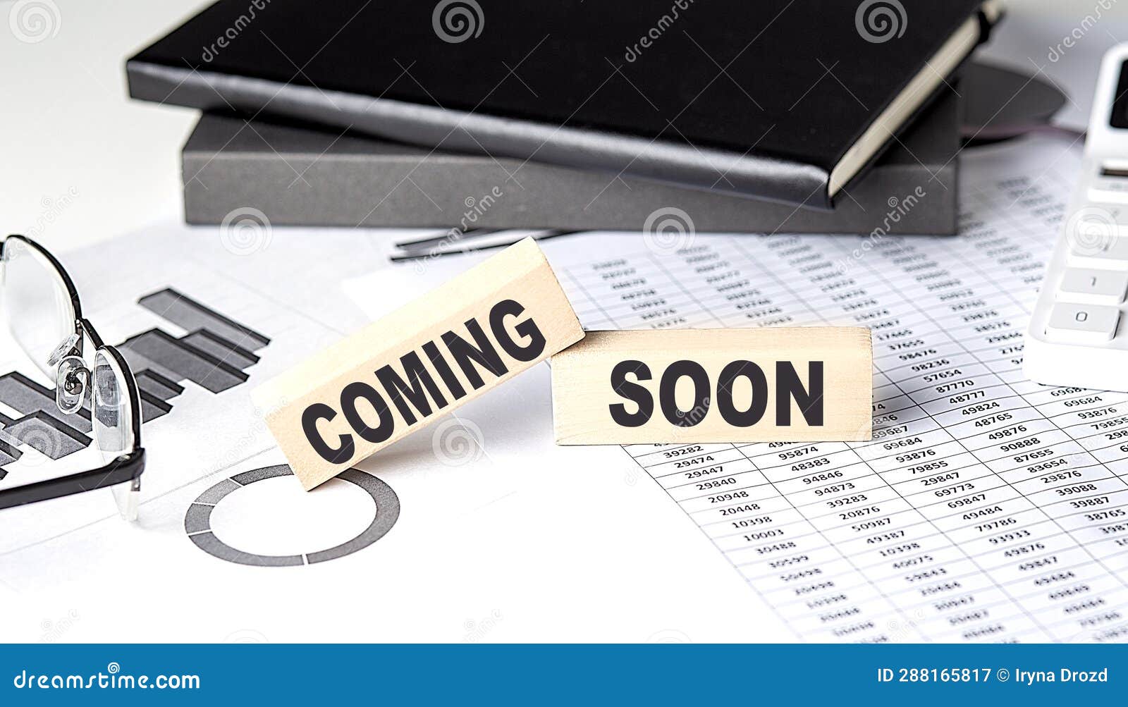 COMING SOON - Text on a Wooden Block with Chart and Notebook Stock ...