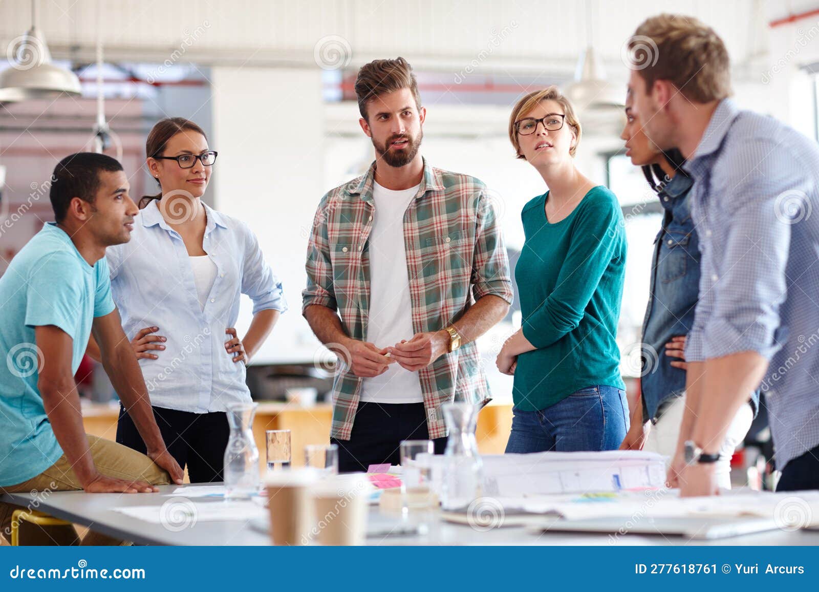 Coming Up with Creative Solutions. a Group of Young Designers Having a ...