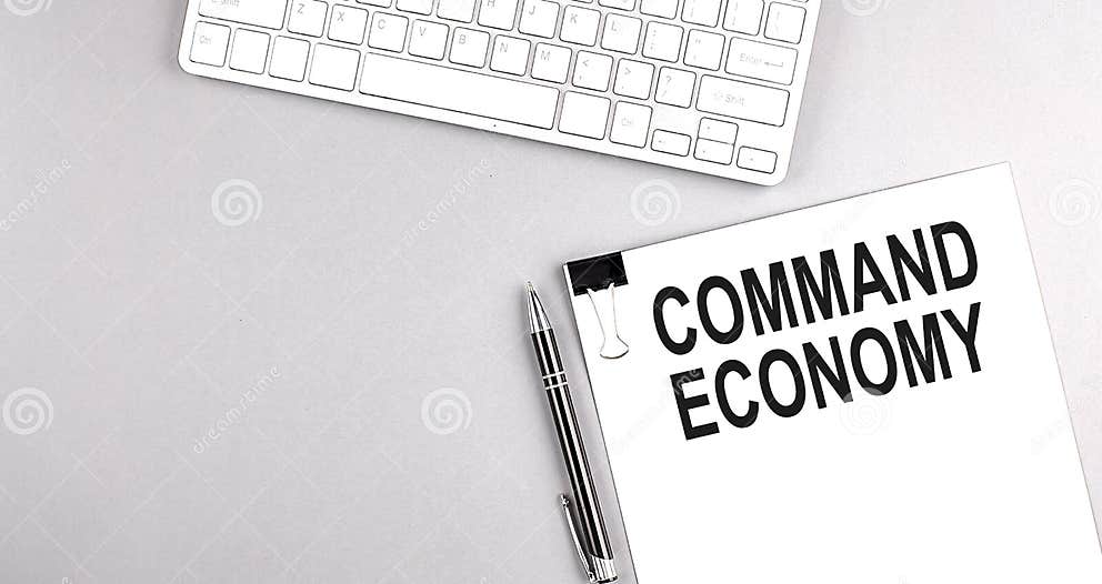 COMMAND ECONOMY Text on Paper with Keyboard on Grey Background Stock ...