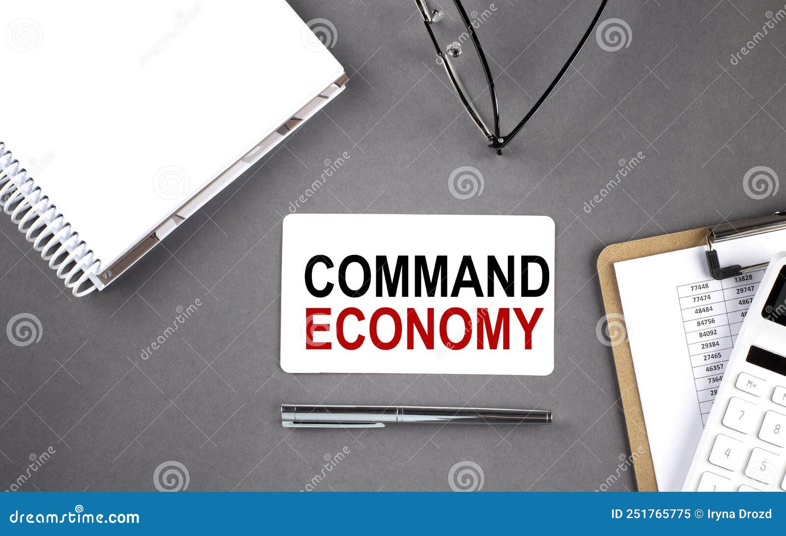 COMMAND ECONOMY Text Written on the Card with Notebook and Clipboard ...