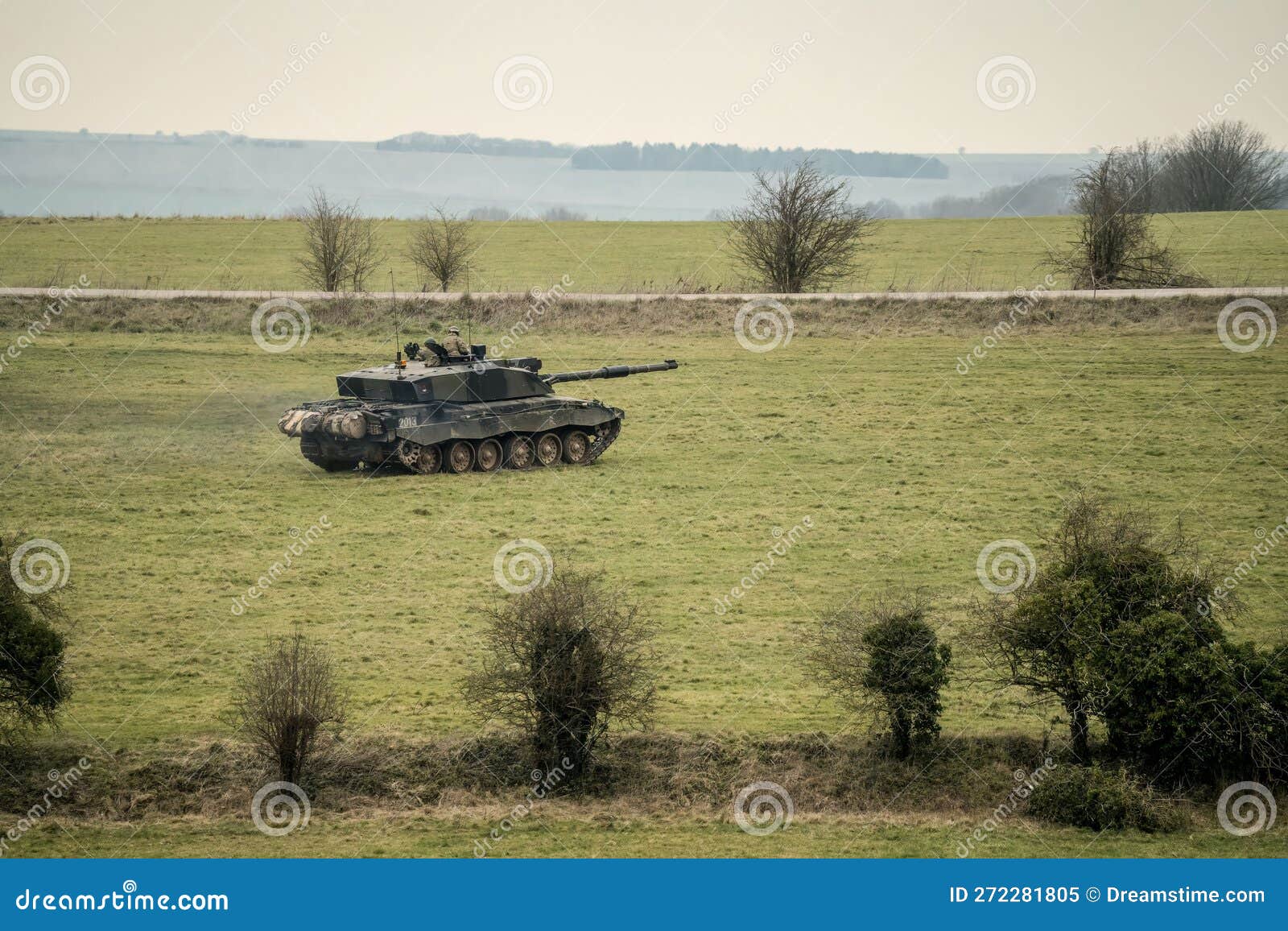 Commander Gunner Challenger Situated in a Grassy Landscape, with Trees ...