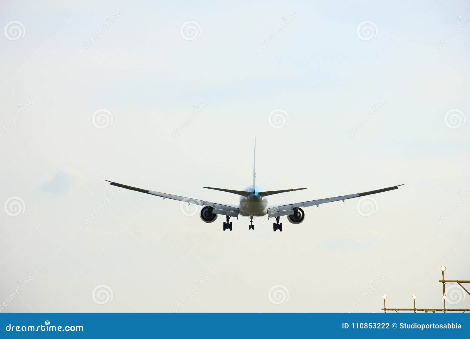 Plane approaching runway stock photo. Image of skyline - 110853222