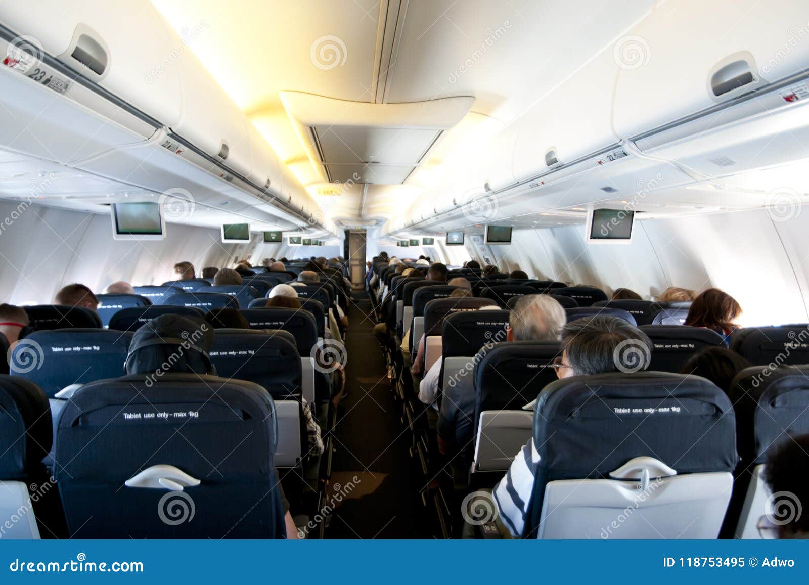 Commercial Flight Passengers Editorial Image - Image of seat, aisle ...