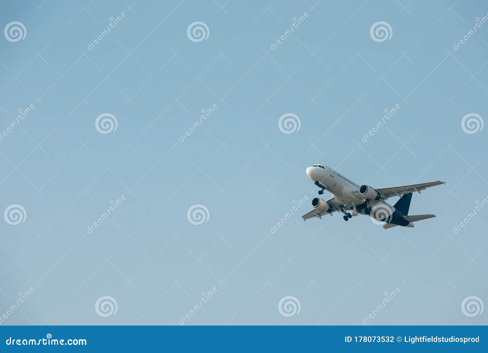 Commercial Jet Plane Taking Off in Blue Sky Stock Photo - Image of ...