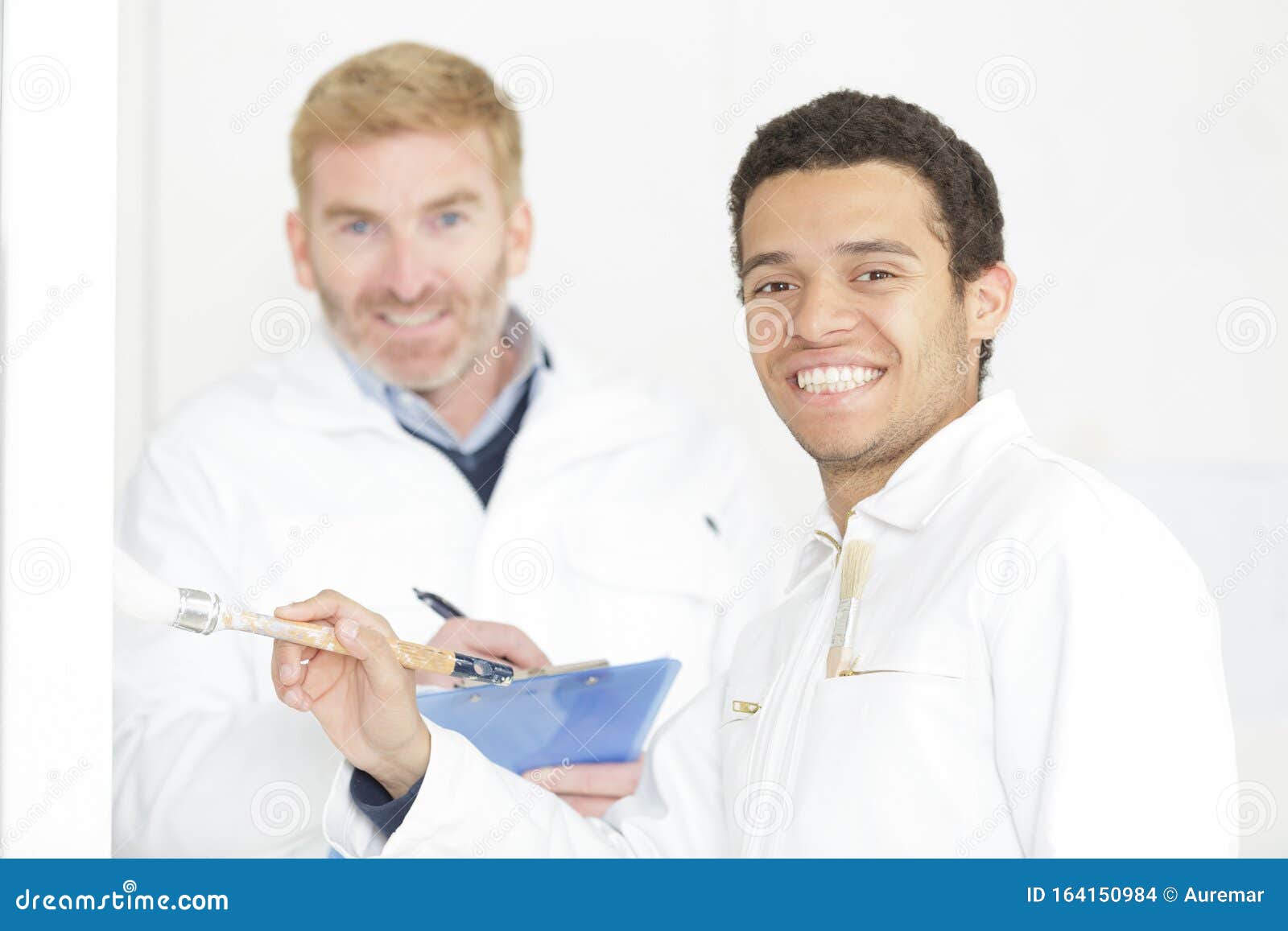 Commercial Painting Apprentice Smiling Next To Trainer Stock Photo ...
