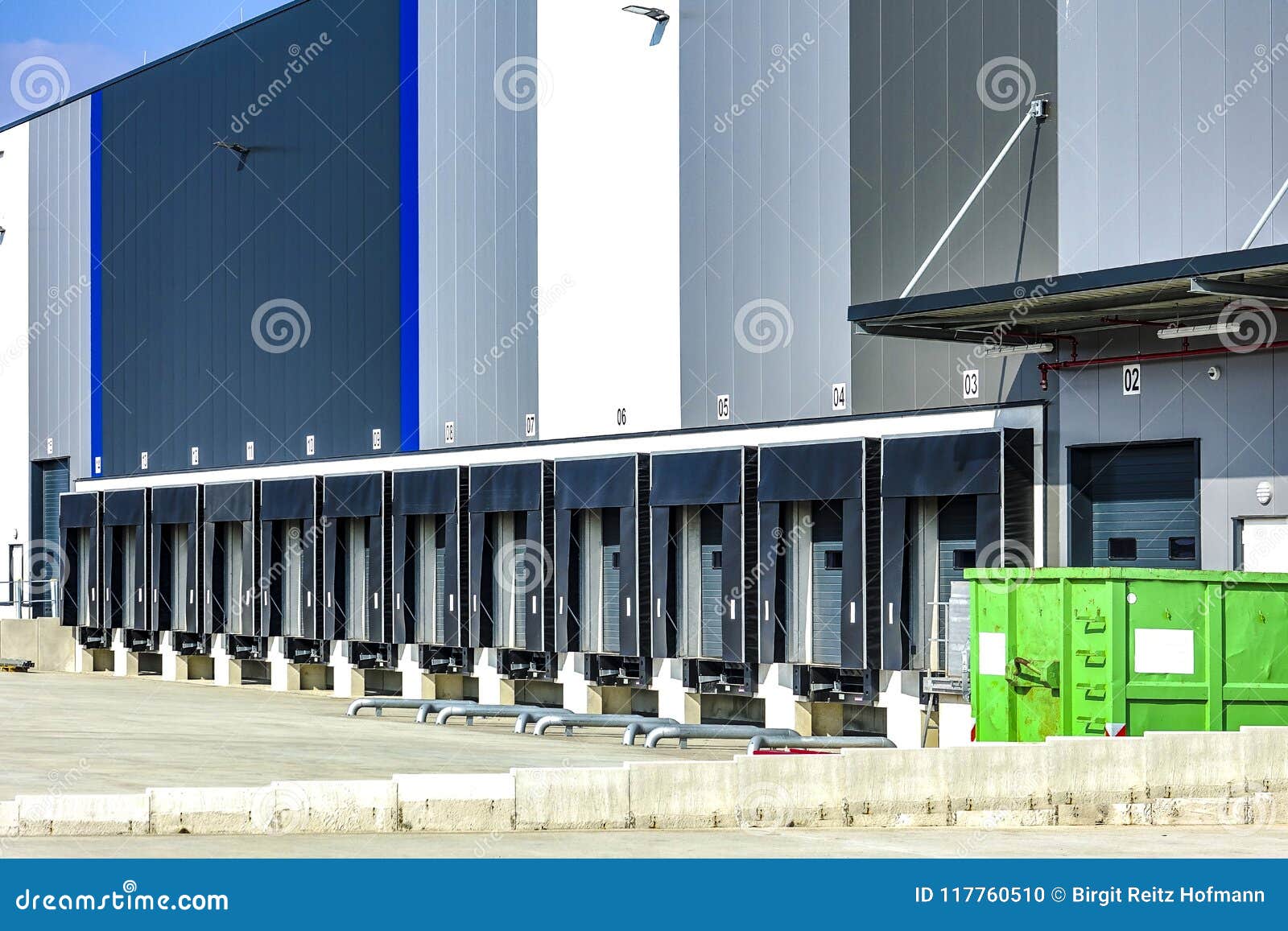 Commercial Warehouse with Multiple Loading Bays Stock Photo - Image of ...