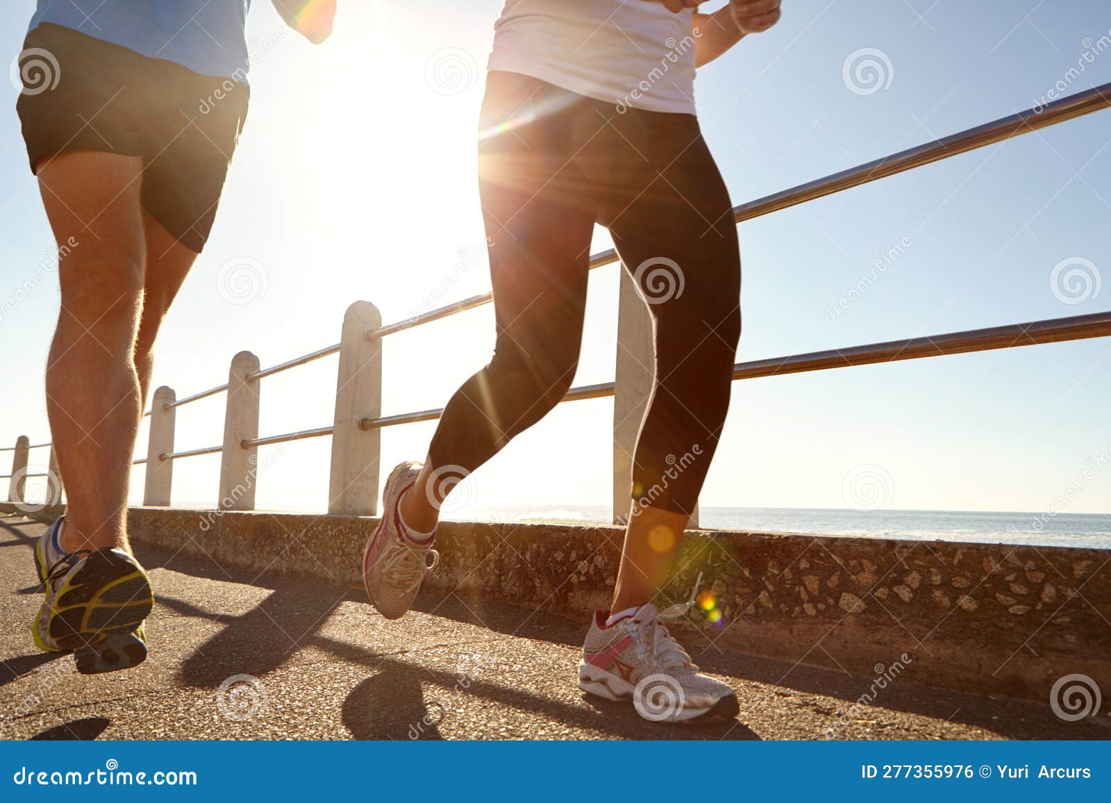 Commit To Be Fit. Two People Jogging on the Promenade. Stock Photo ...