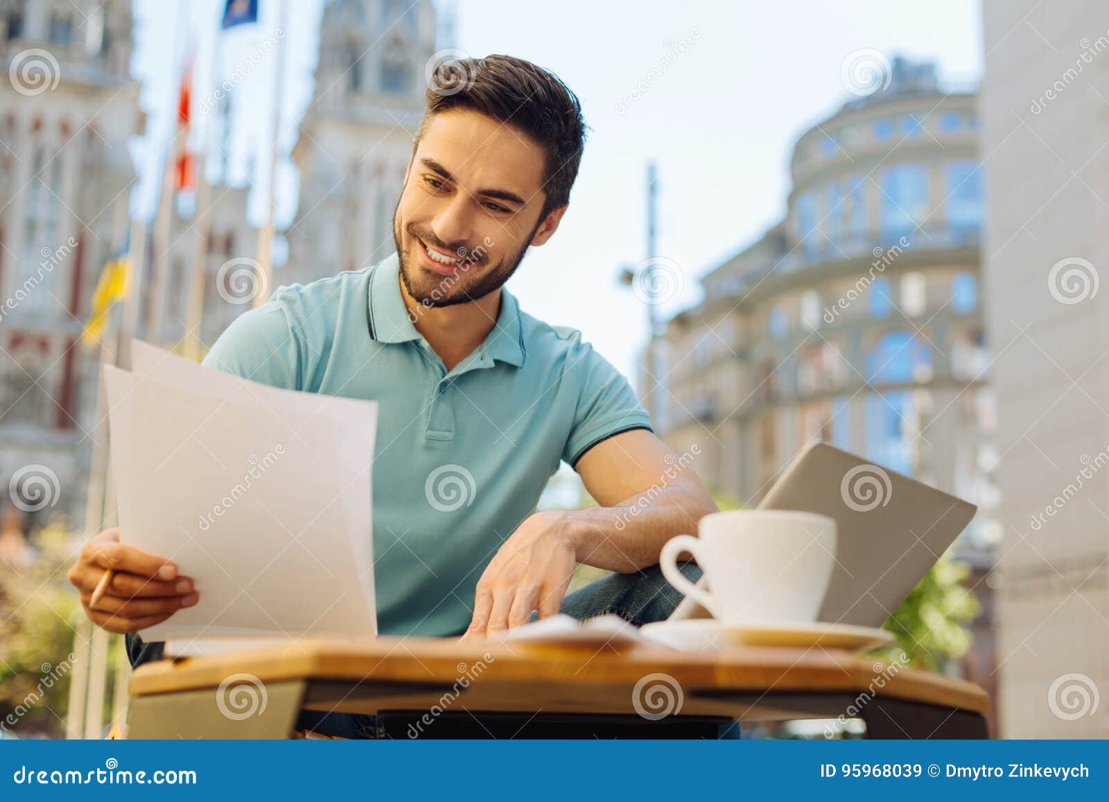 Committed Handsome Man Reading the Documents Carefully Stock Image ...