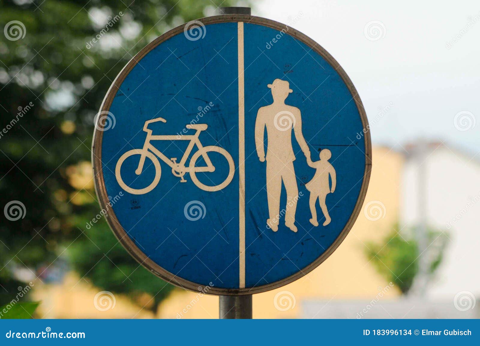 Pedestrian And Bicycle Riders Sharing The Street Lanes With Road ...