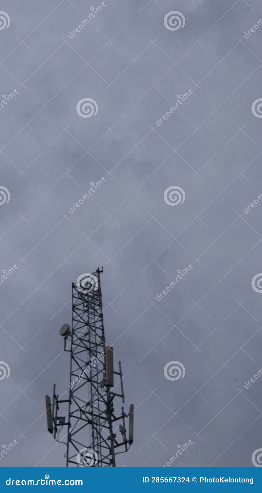 Communication Building Antenna with a Backdrop of Mountains and Sky ...
