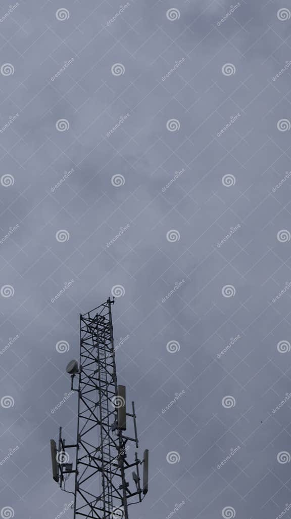 Communication Building Antenna with a Backdrop of Mountains and Sky ...