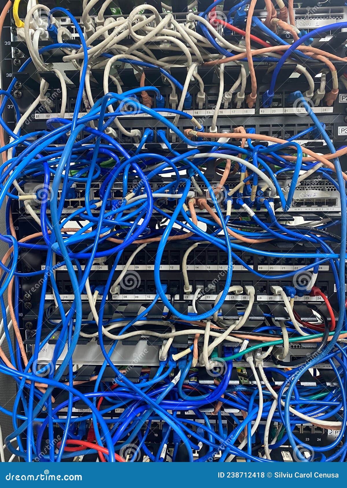 Communication Rack with Messy Patch Cables Blue and Grey Closeup View ...