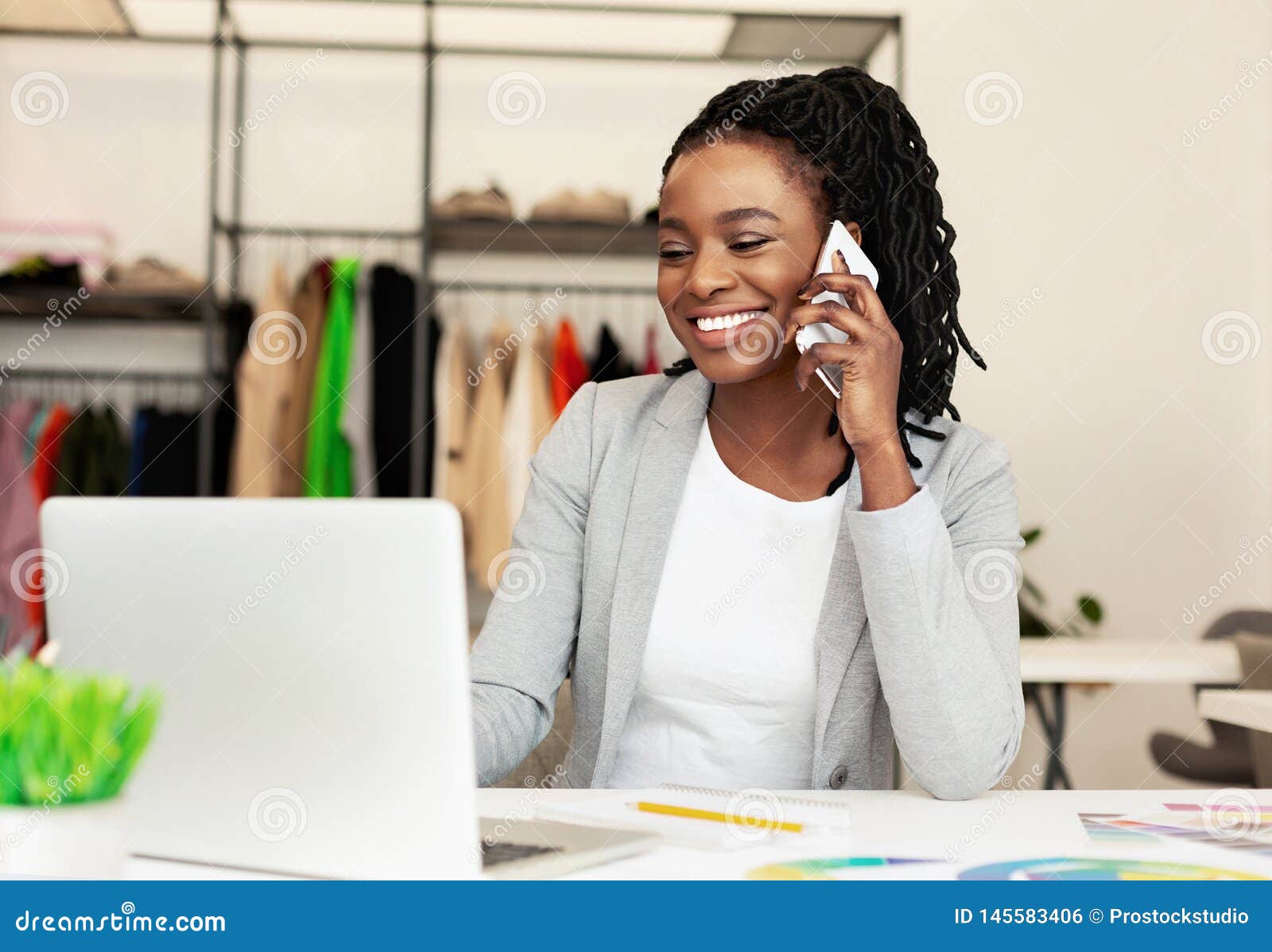 Communication with Suppliers. Woman Tailor Talking on Phone Stock Photo ...