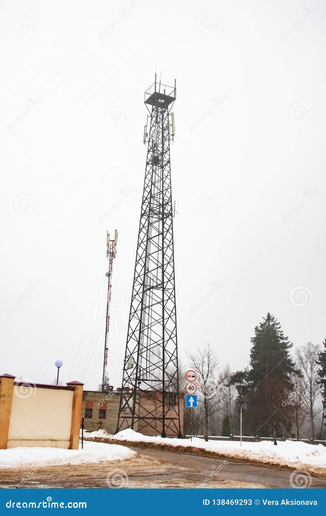 Communication Tower on a Background of Gray Sky and Trees Stock Image ...