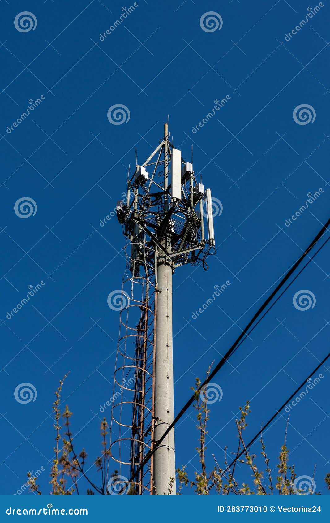 Communication Transmitters on a Concrete Pole Against the Blue Sky ...