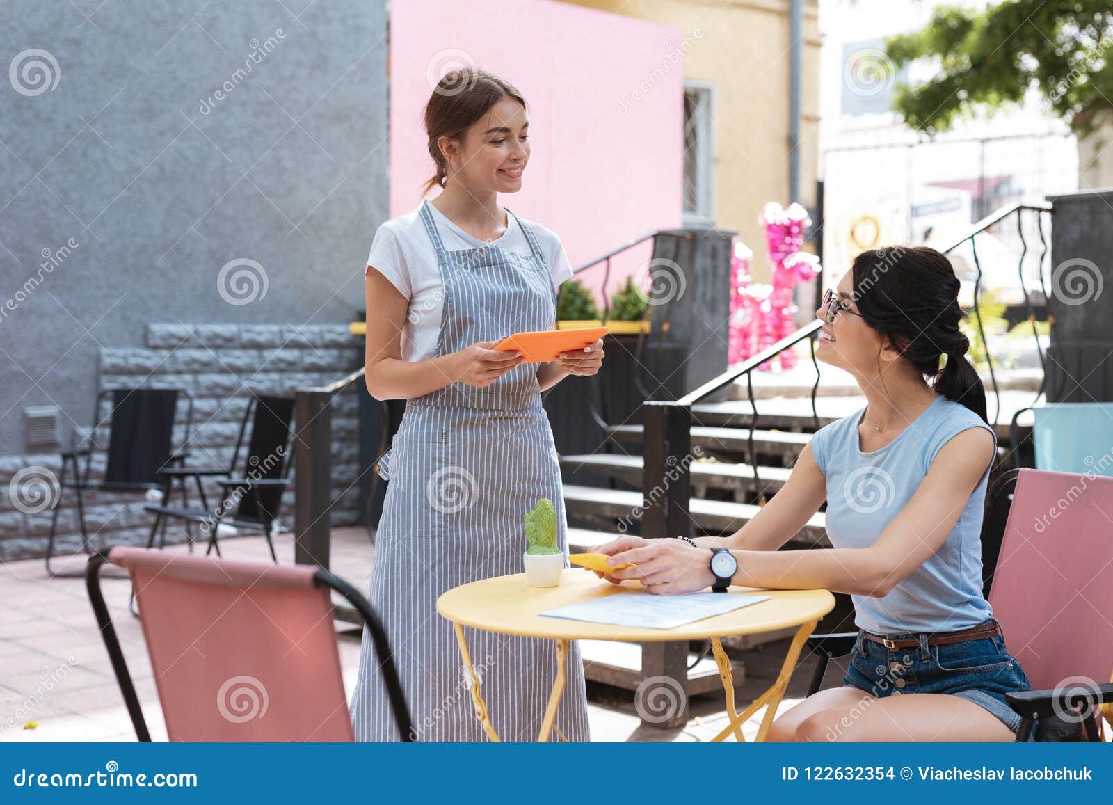 Beaming Client of Restaurant Enjoying Communication with Waitress Stock ...