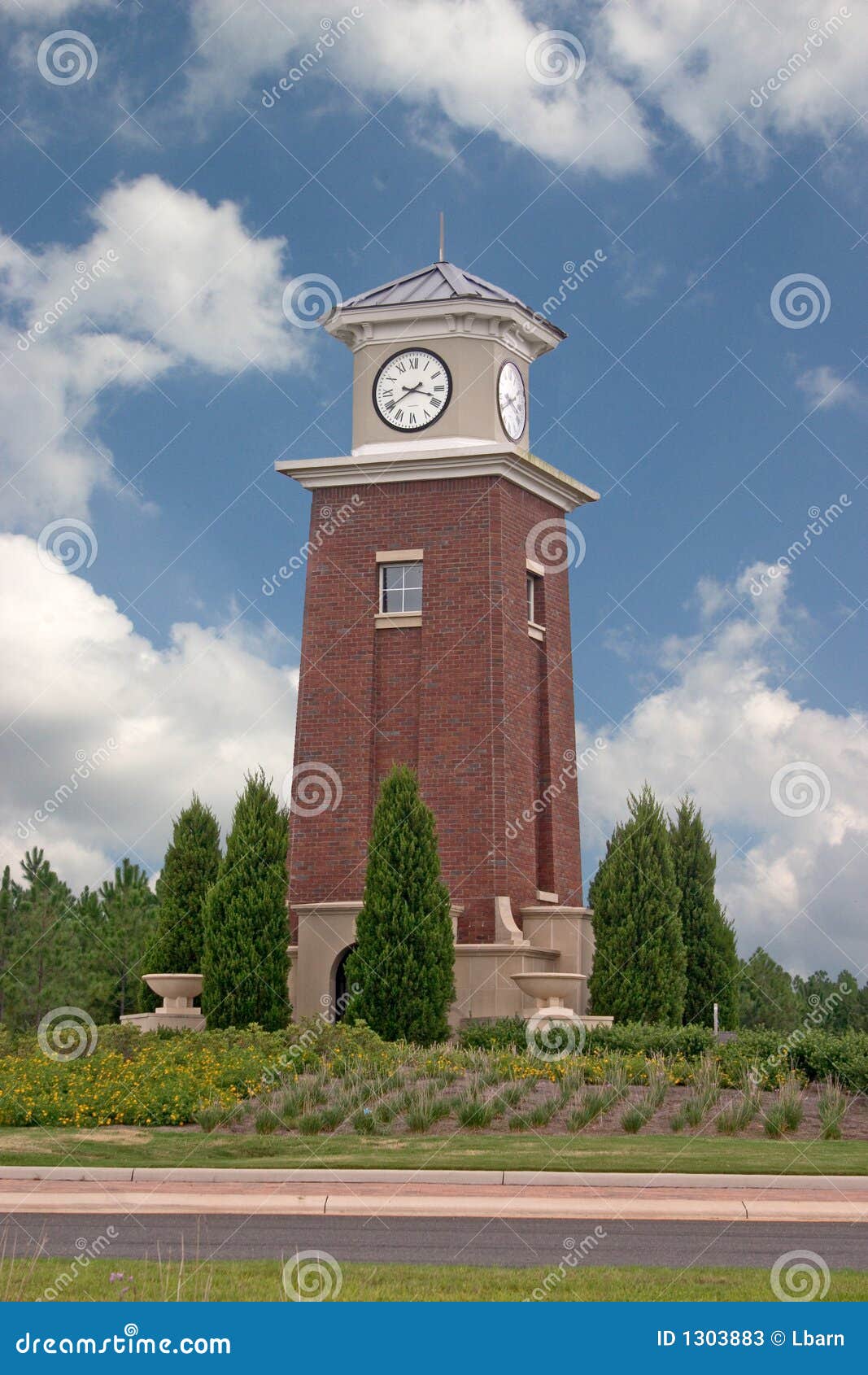 Community clock tower stock image. Image of tower, flowers - 1303883