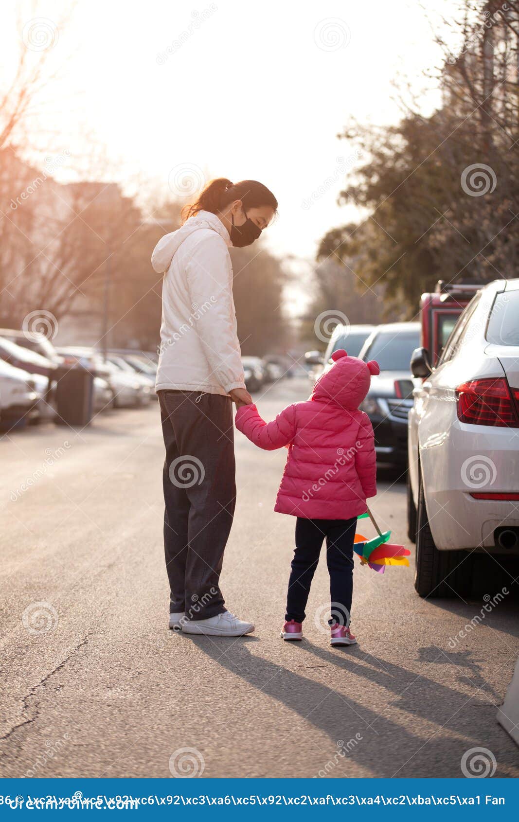 In the Community, the Mother Holding the Child Back Stock Photo - Image ...