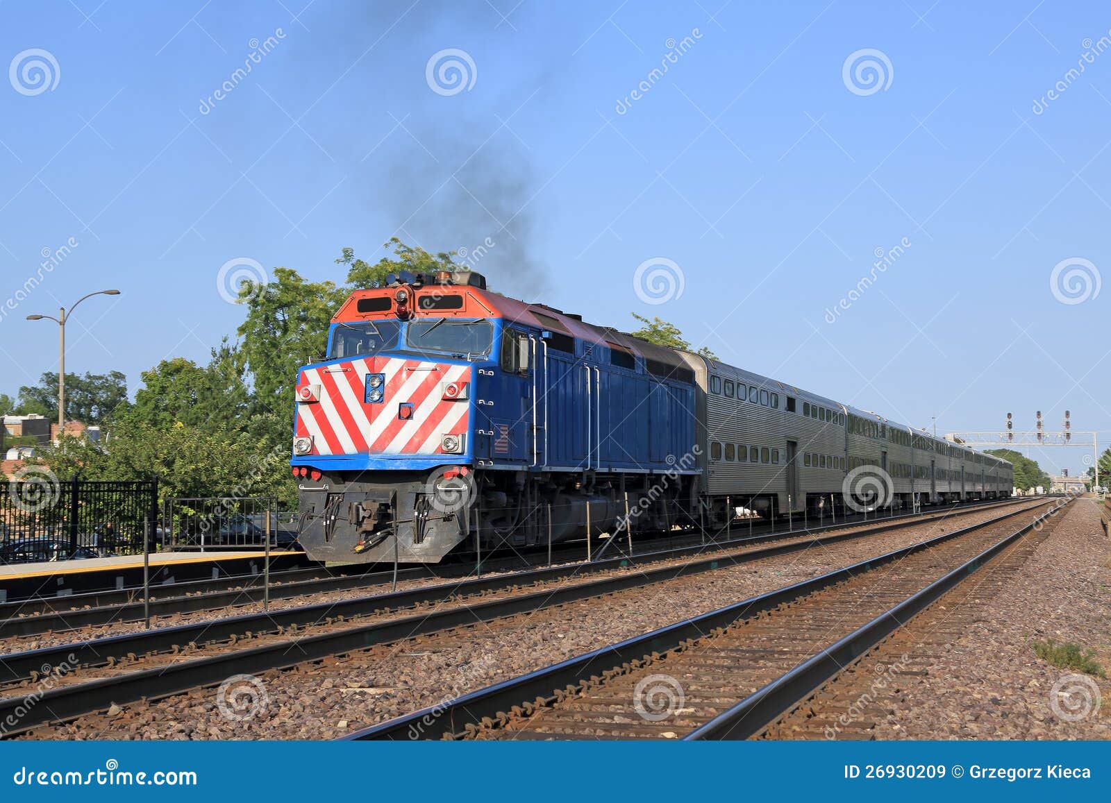 Commuter train approaching stock image. Image of station - 26930209
