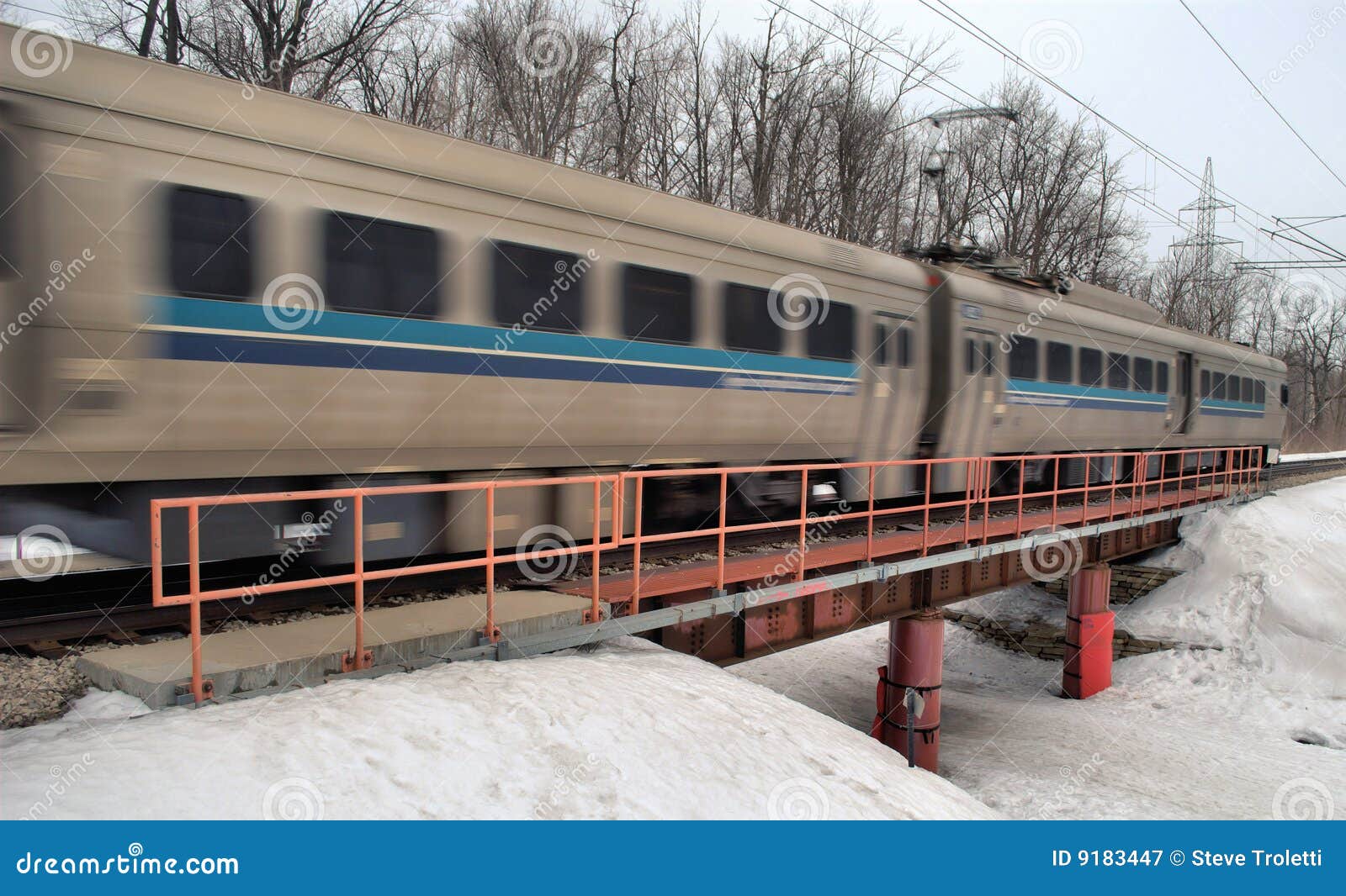 Commuter Train Crossing Bridge Stock Image - Image of motion, blurr ...