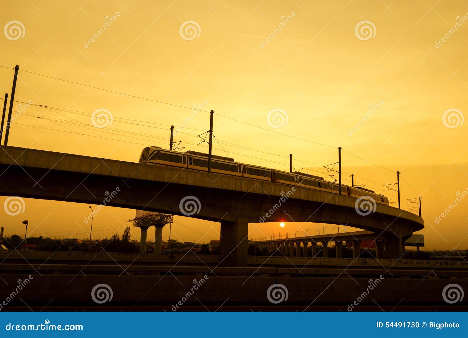 Commuter Train on Elevated Track Stock Photo - Image of view, sunset ...