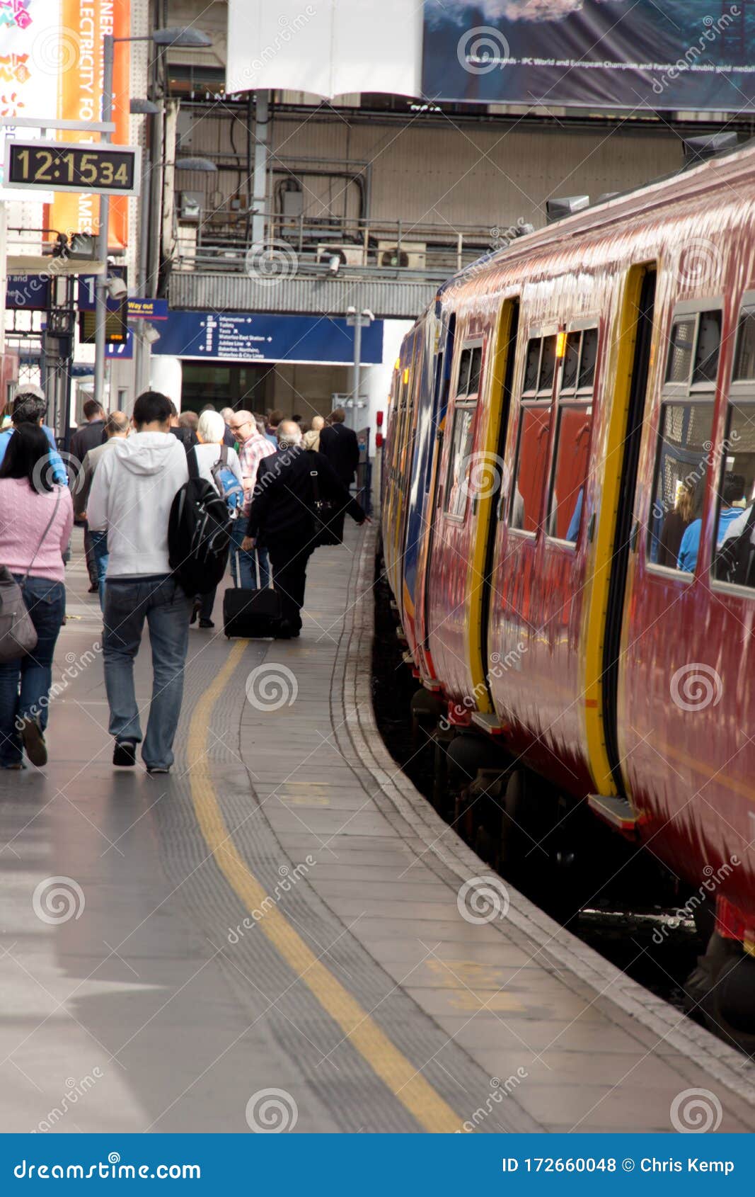A Commuter Train at London Waterloo Station with Passengers Walking ...