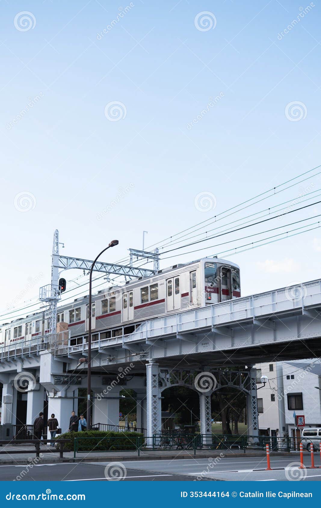 Commuter Train Passing Over Bridge in Urban Japan Editorial Stock Image ...