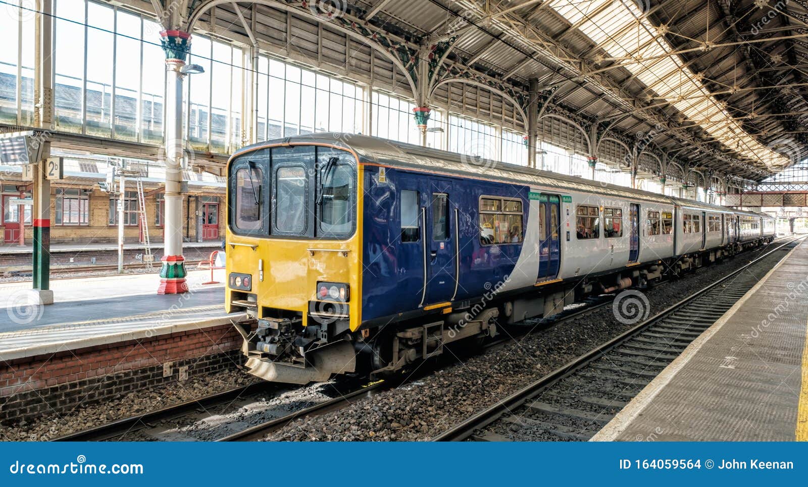 A Commuter Train at the Platform Stock Photo - Image of commuters ...