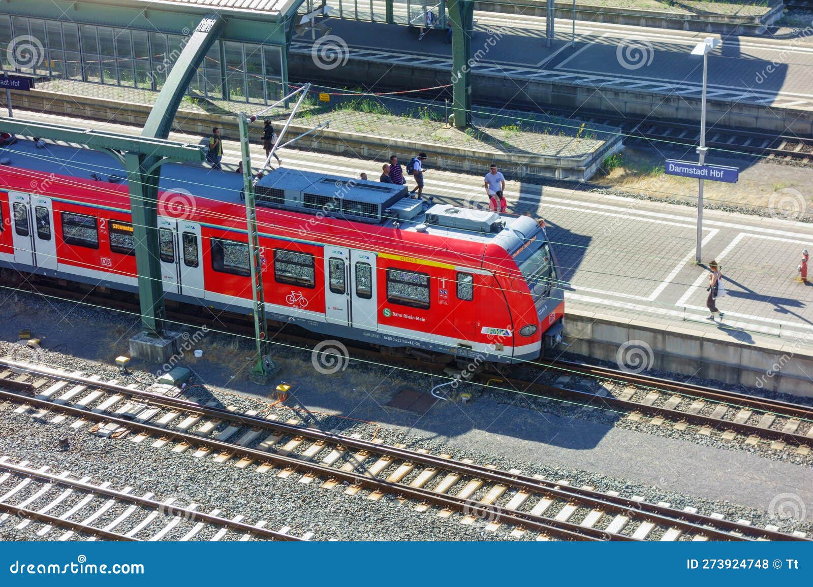 Commuter Train at a Station and with Commuters Editorial Stock Photo ...