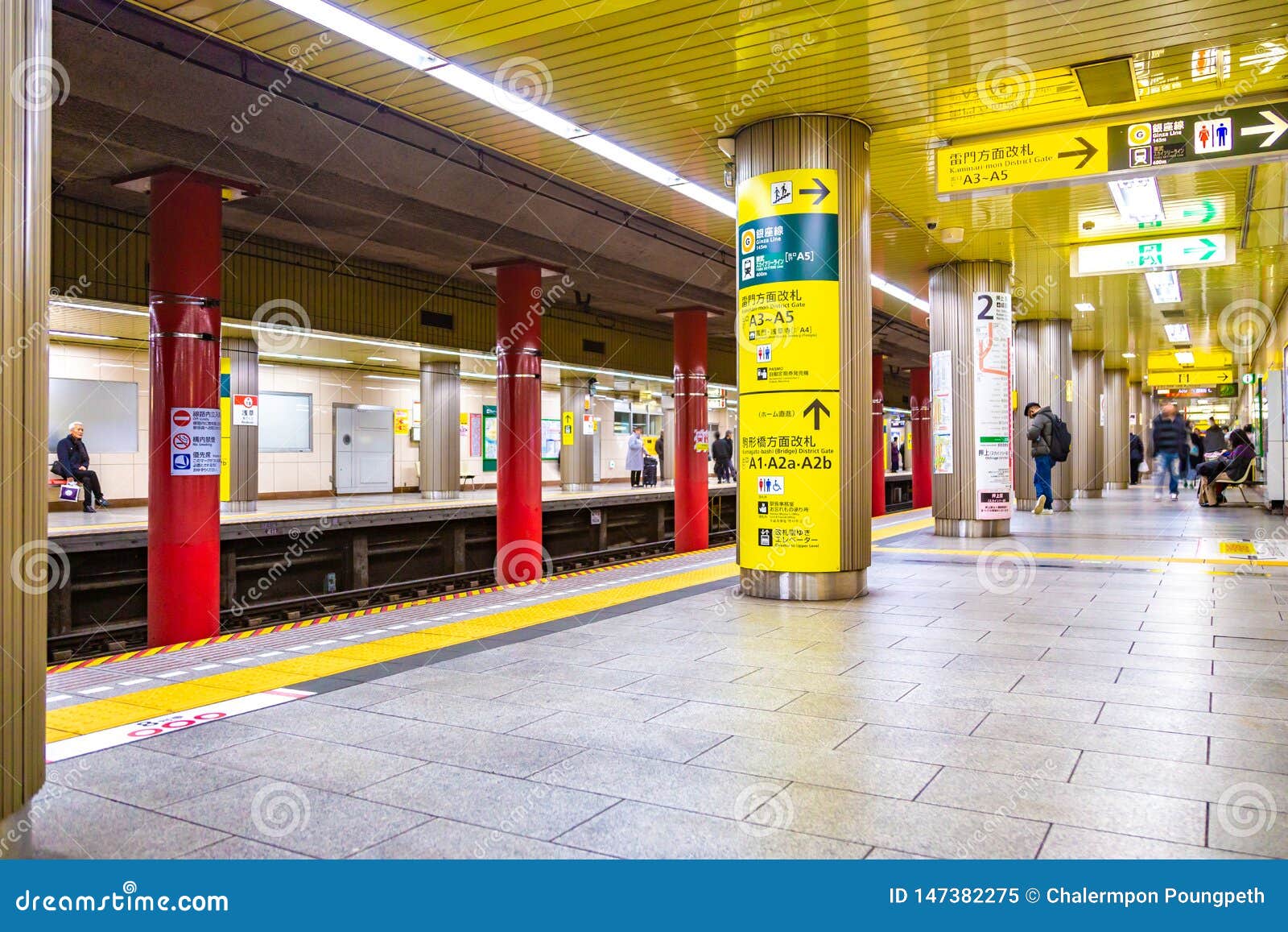 Commuters Wait for the Subway Train at a Subway Station in Tokyo, Japan ...