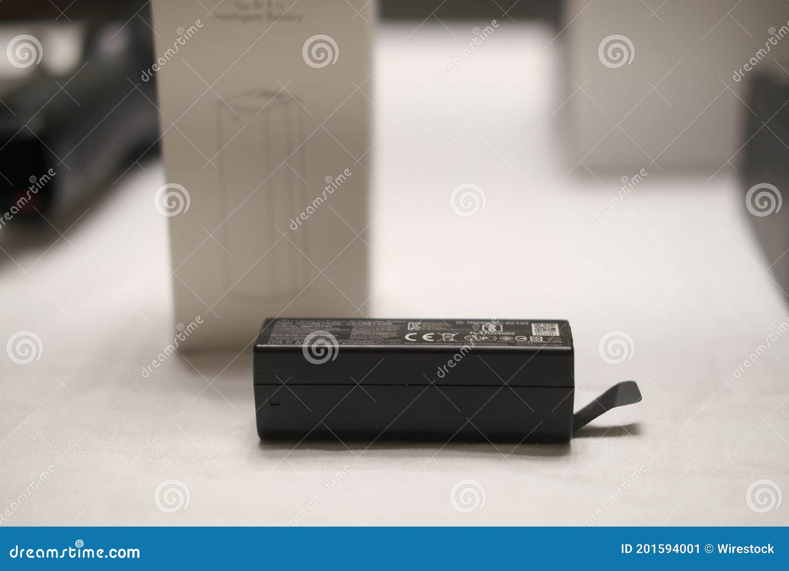 Compact Battery Charger on a Table Editorial Photo - Image of modern ...