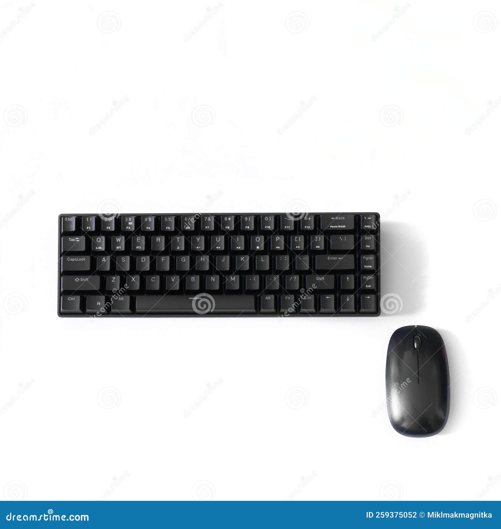 Compact Black Gaming Computer Keyboard and Mouse on a White Background ...