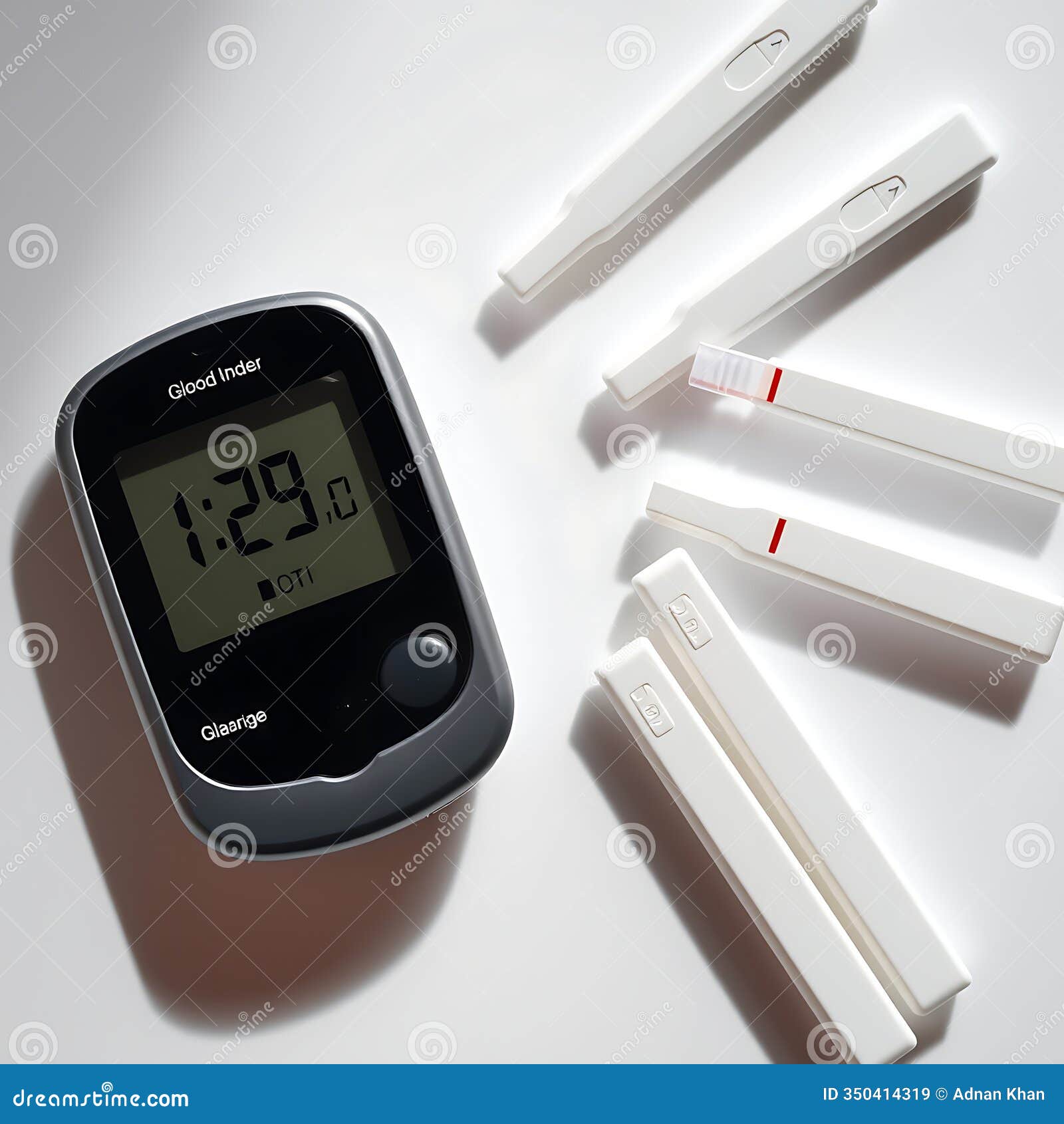 A Compact Blood Glucose Meter with Display and Test Strips Arranged on ...
