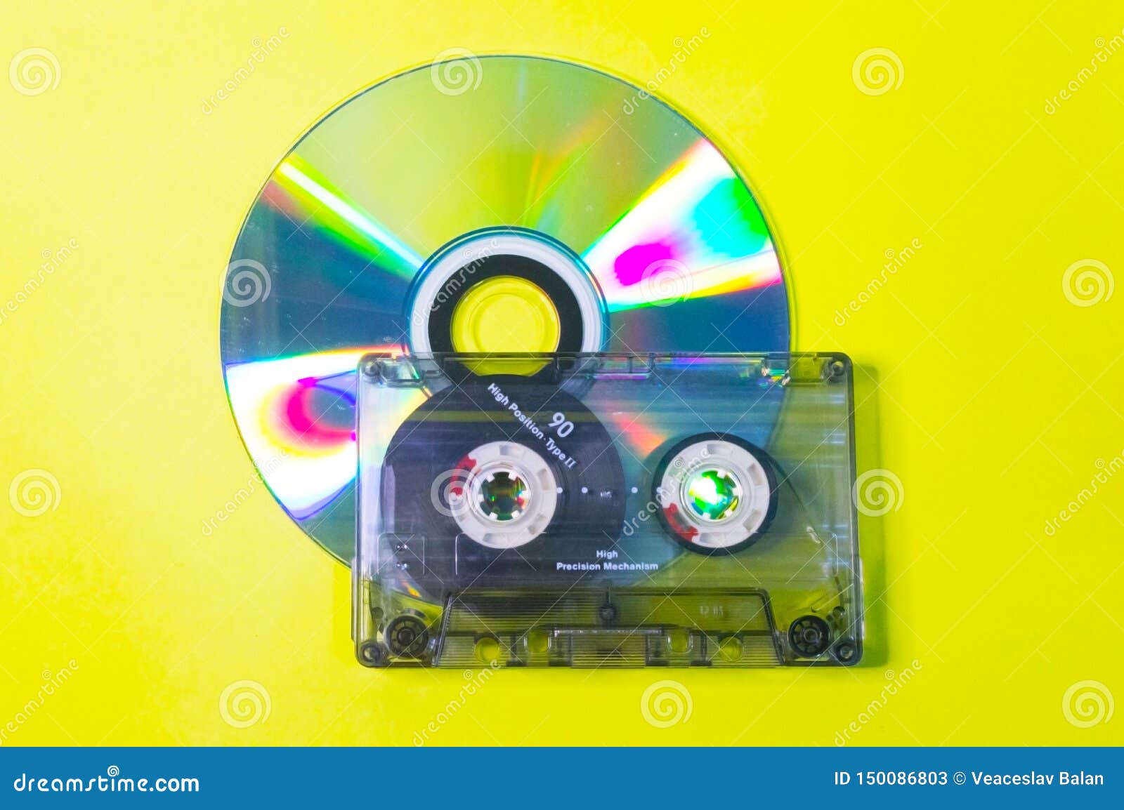 Compact Disc and Audio Cassette on a Yellow Background Stock Image ...
